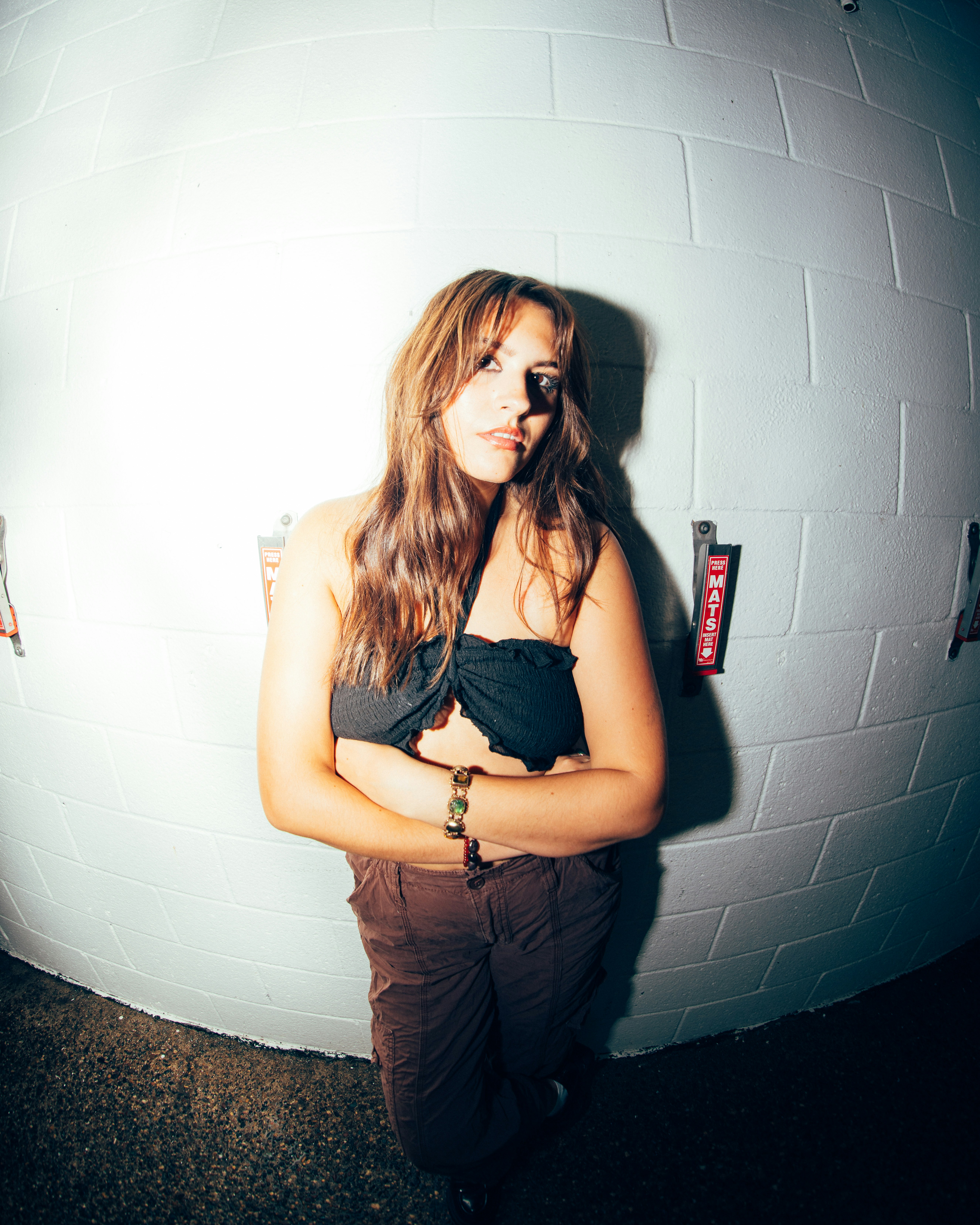 Facing the Curve: Portrait by a Curved White Wall