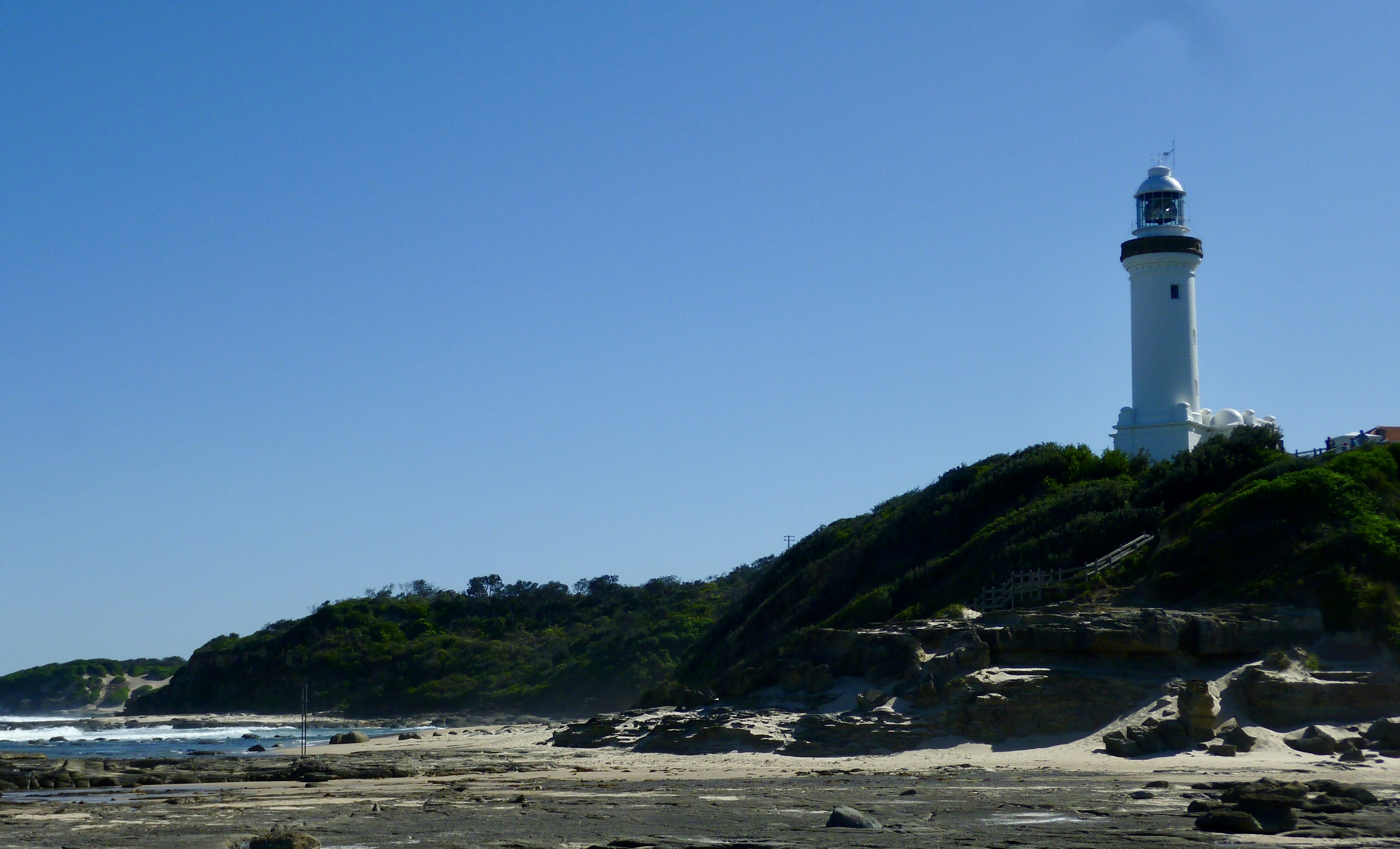A light house on a hill overlooking the ocean photo – Free Norah head ...