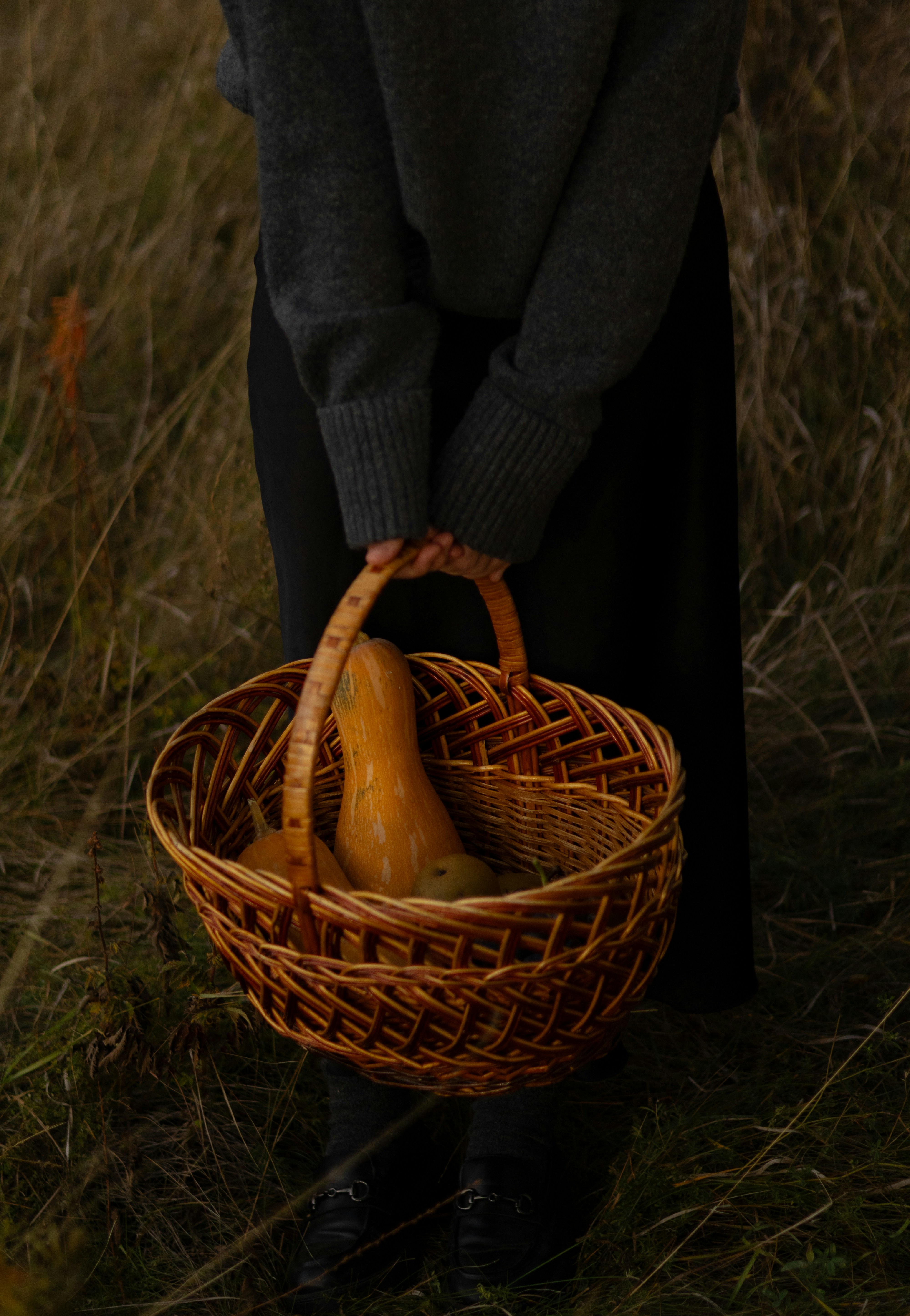 Dusk Harvest: A Wicker Basket Brimming with Autumn Gourds