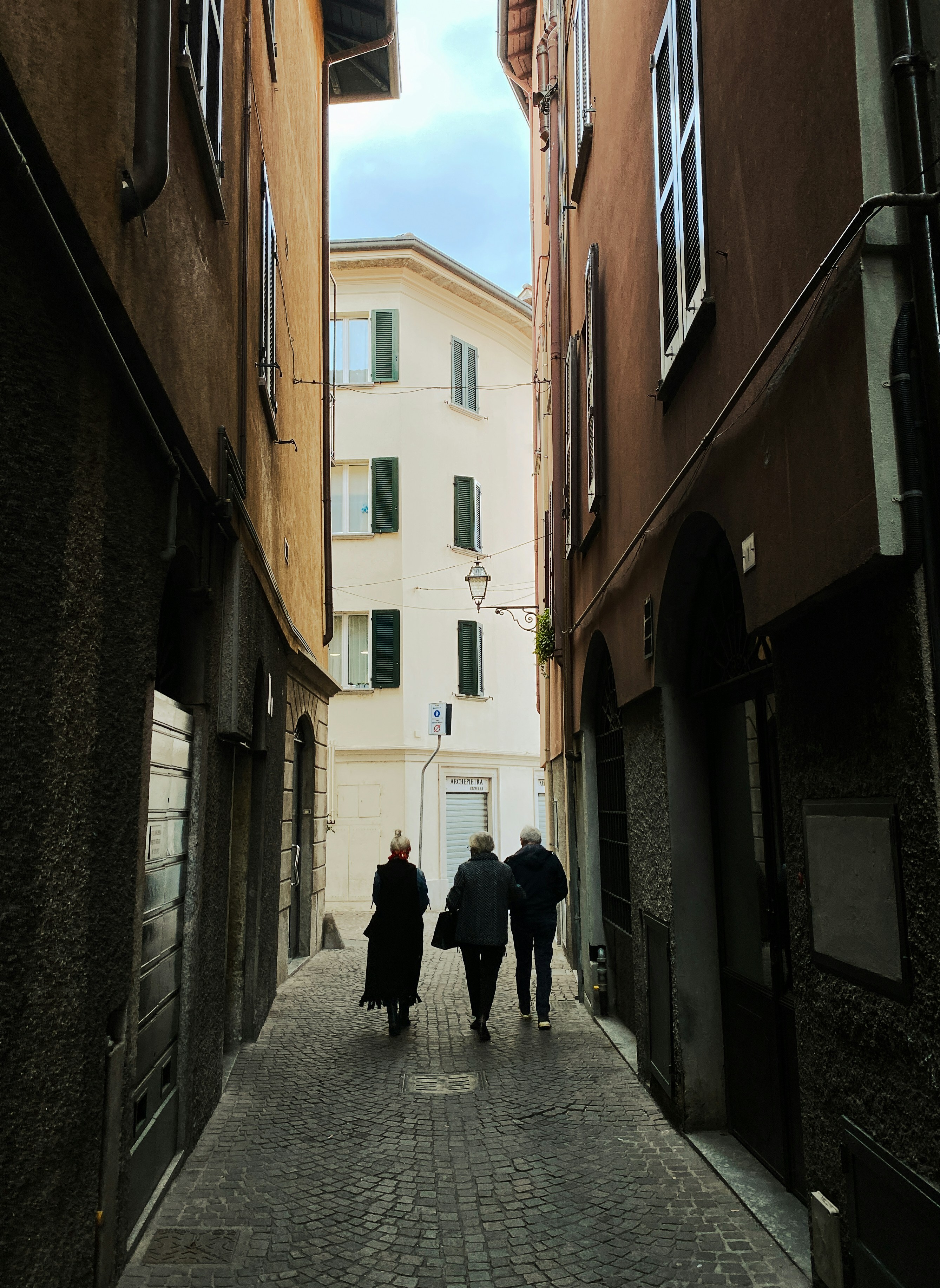 Sunlit Narrow Lane: Five Figures at the Blue Sky Threshold