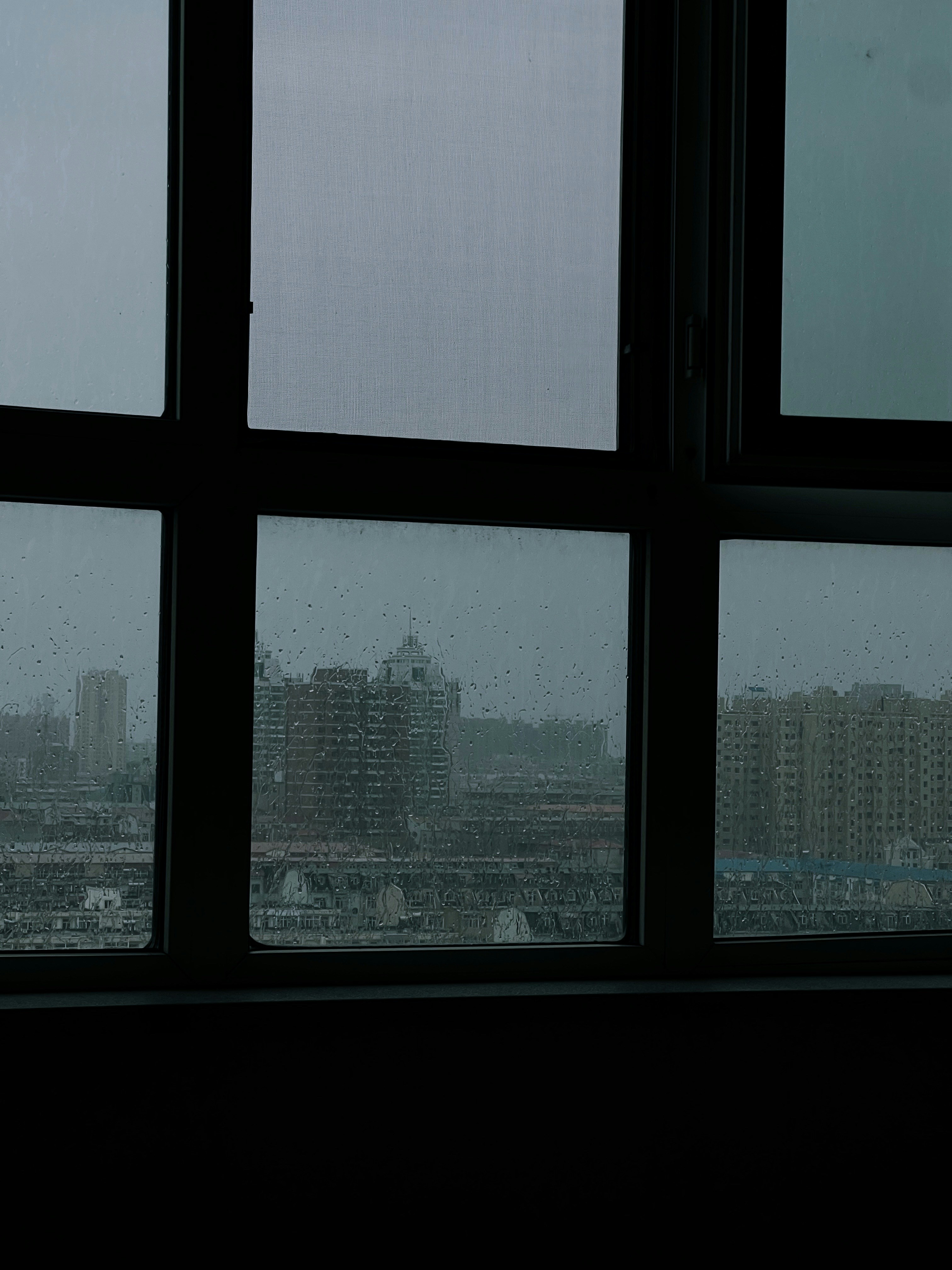 A view of a city through a window photo – Free Grey Image on Unsplash