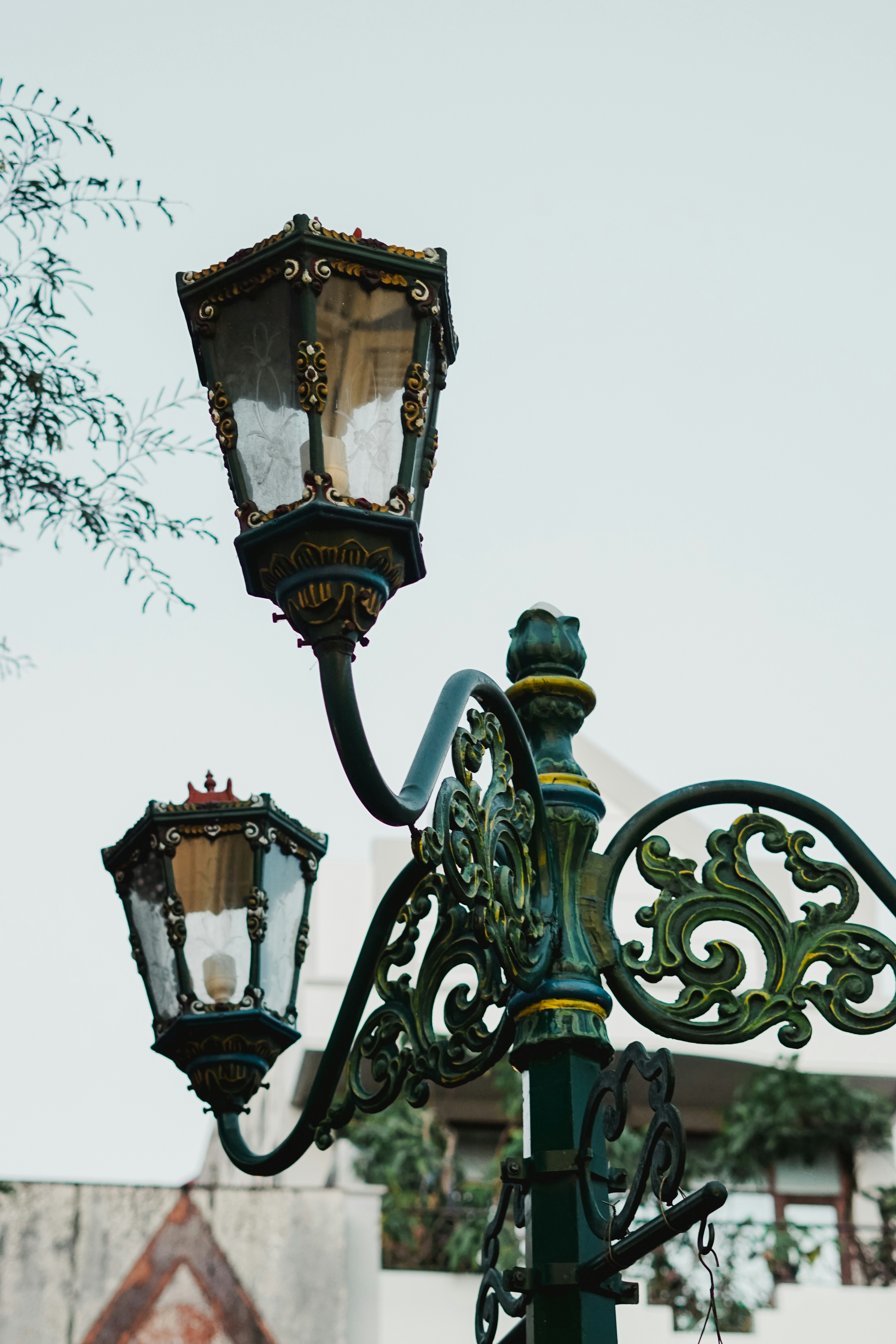 A lamp post with two lights attached to it photo – Free Lamp Image on ...