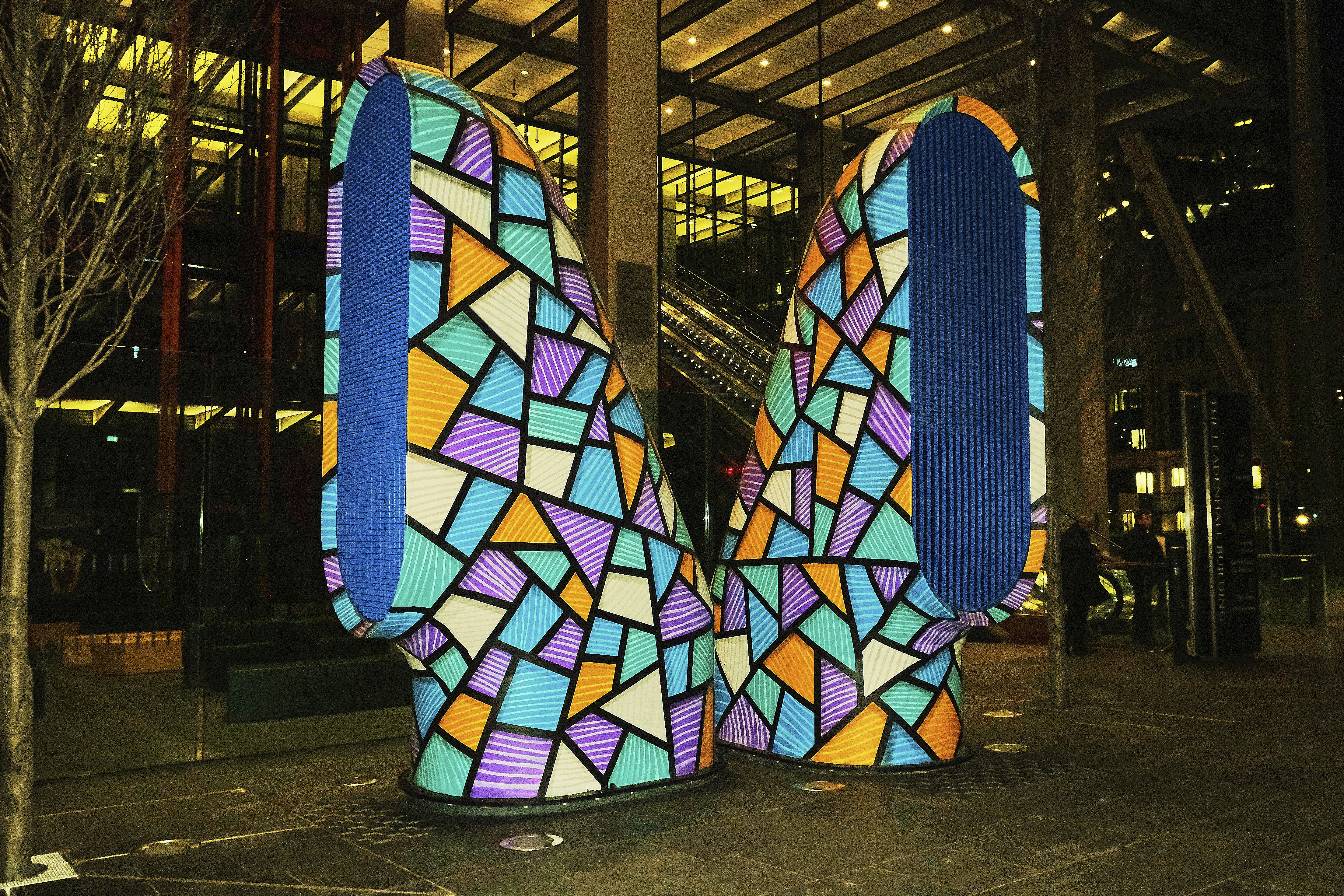 Mosaic Pillars of Light: A Playful Urban Greeting