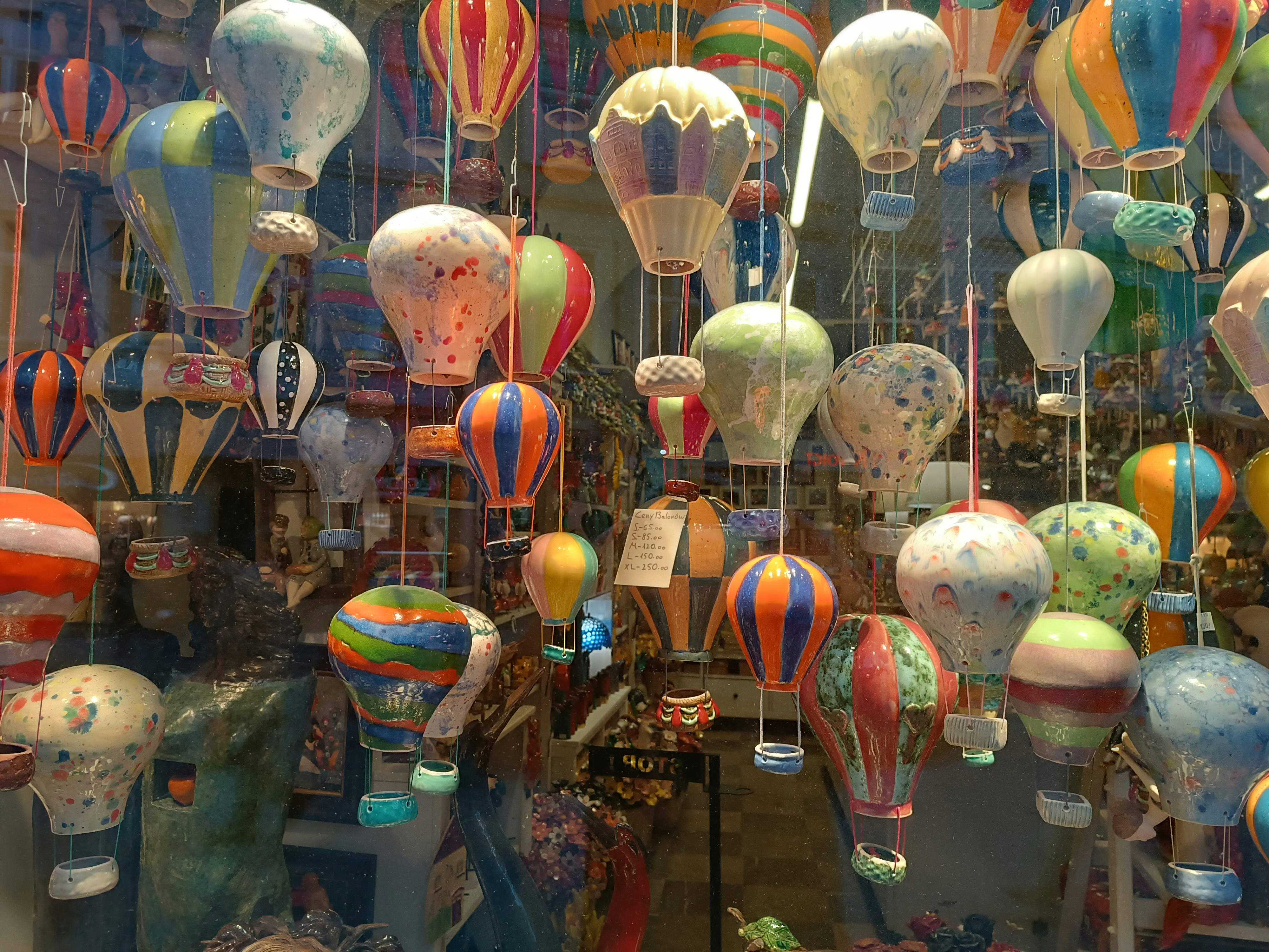 Balloon Bazaar Behind Glass: A Dense Rainbow Window Display