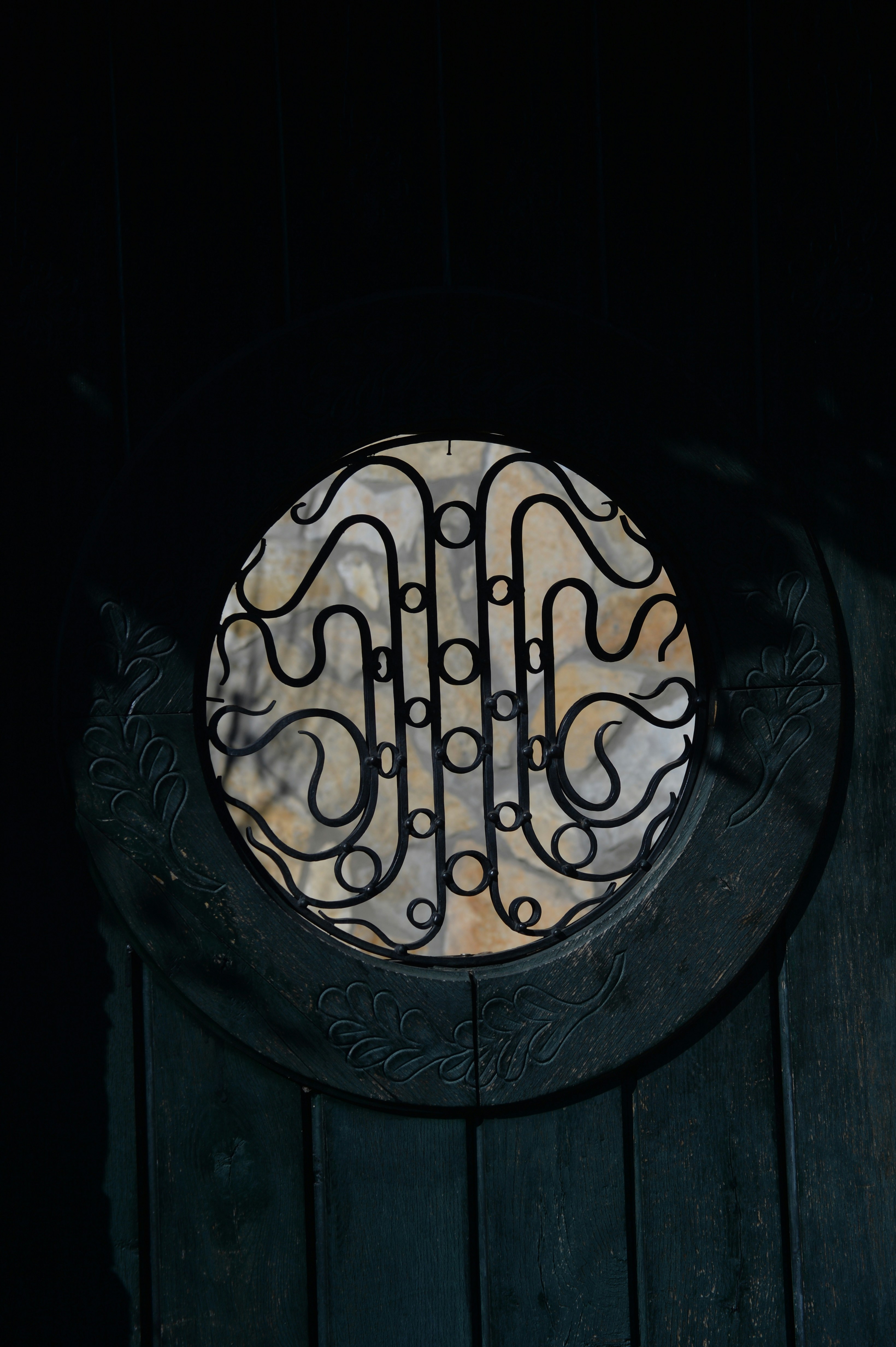 A door with a circular iron design on it photo – Free Window Image on ...