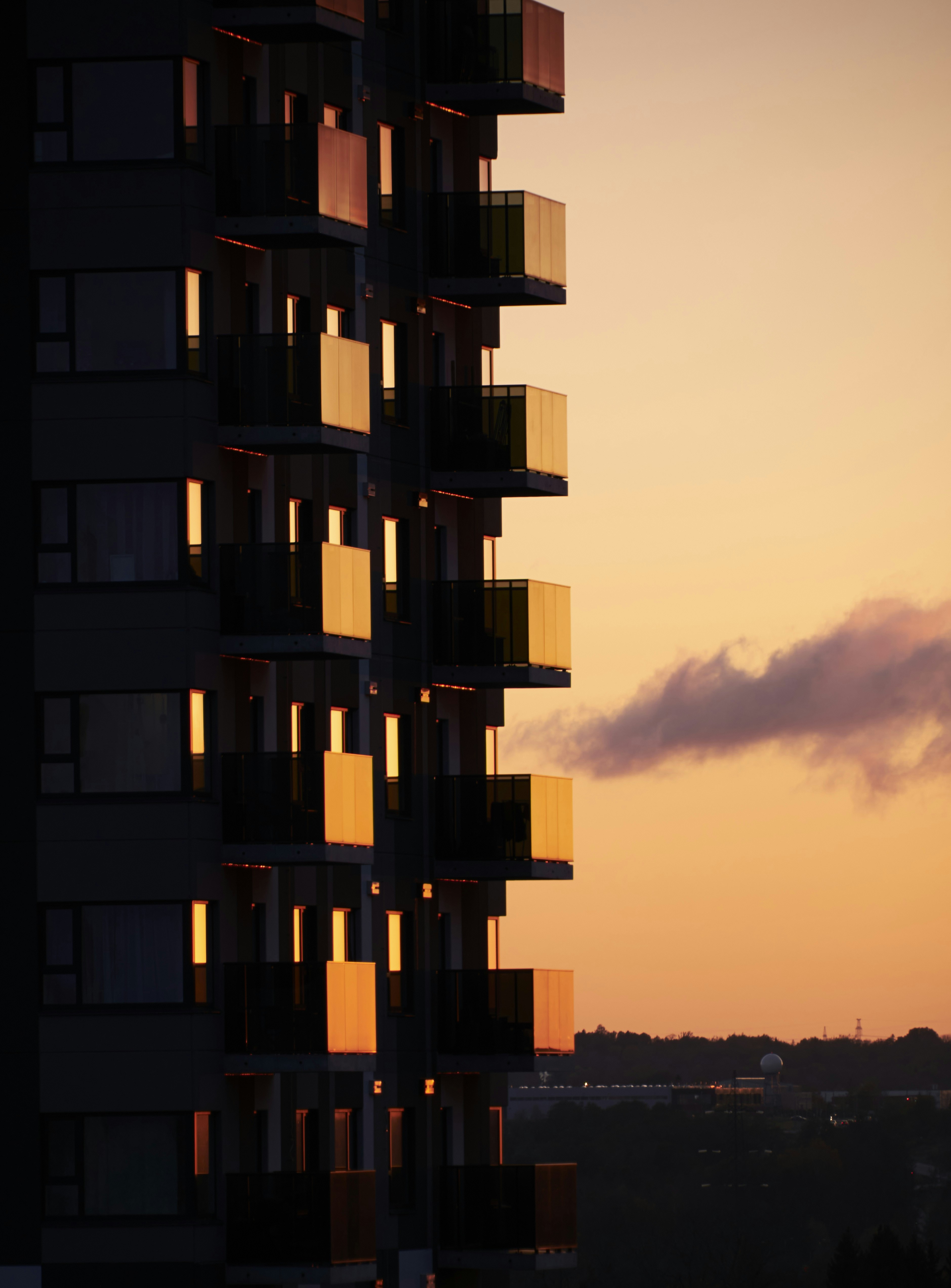 Gilded Facades: Sunset Traces a Corridor of Balconies