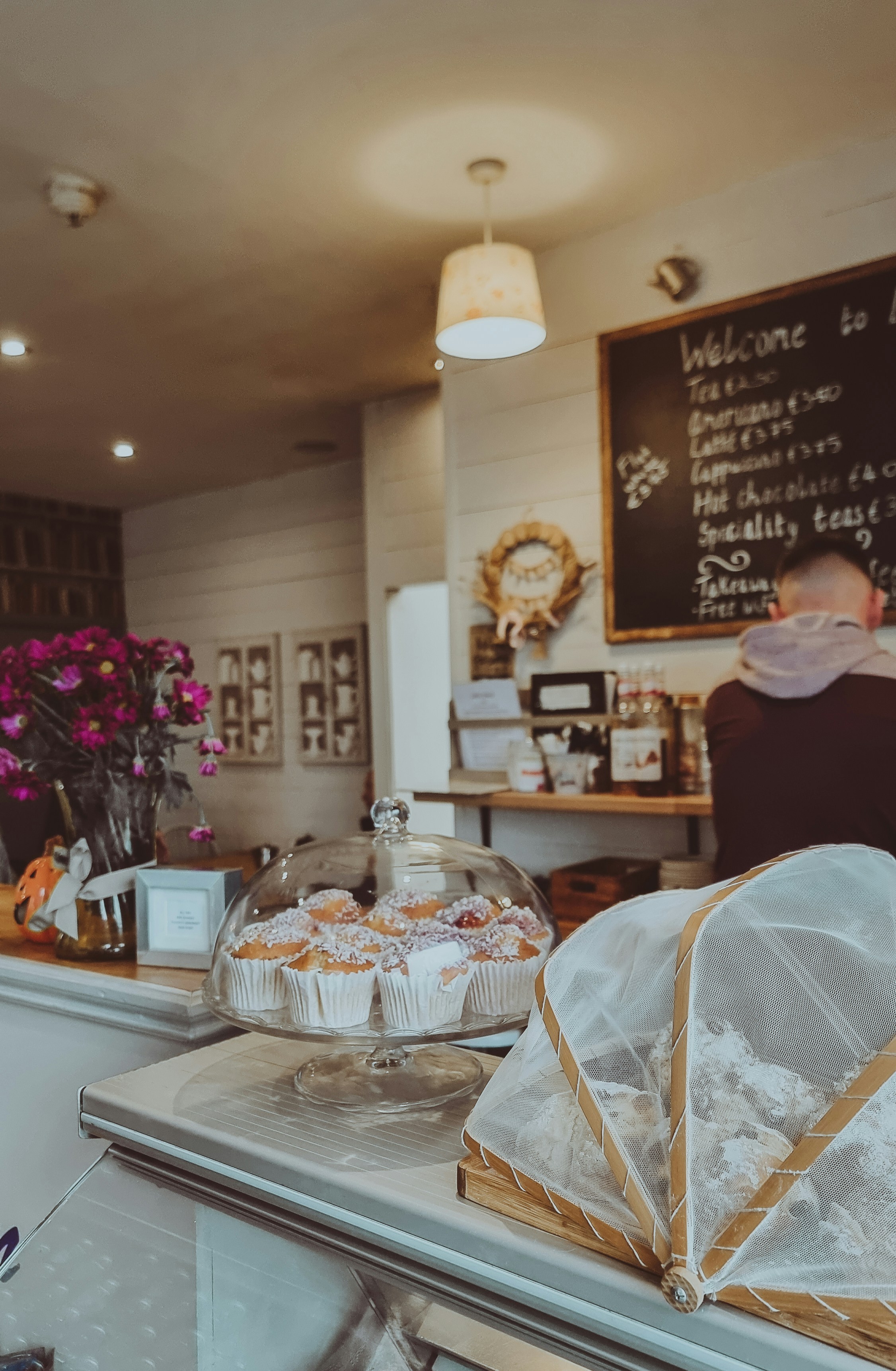 a bakery counter with a variety of pastries on it