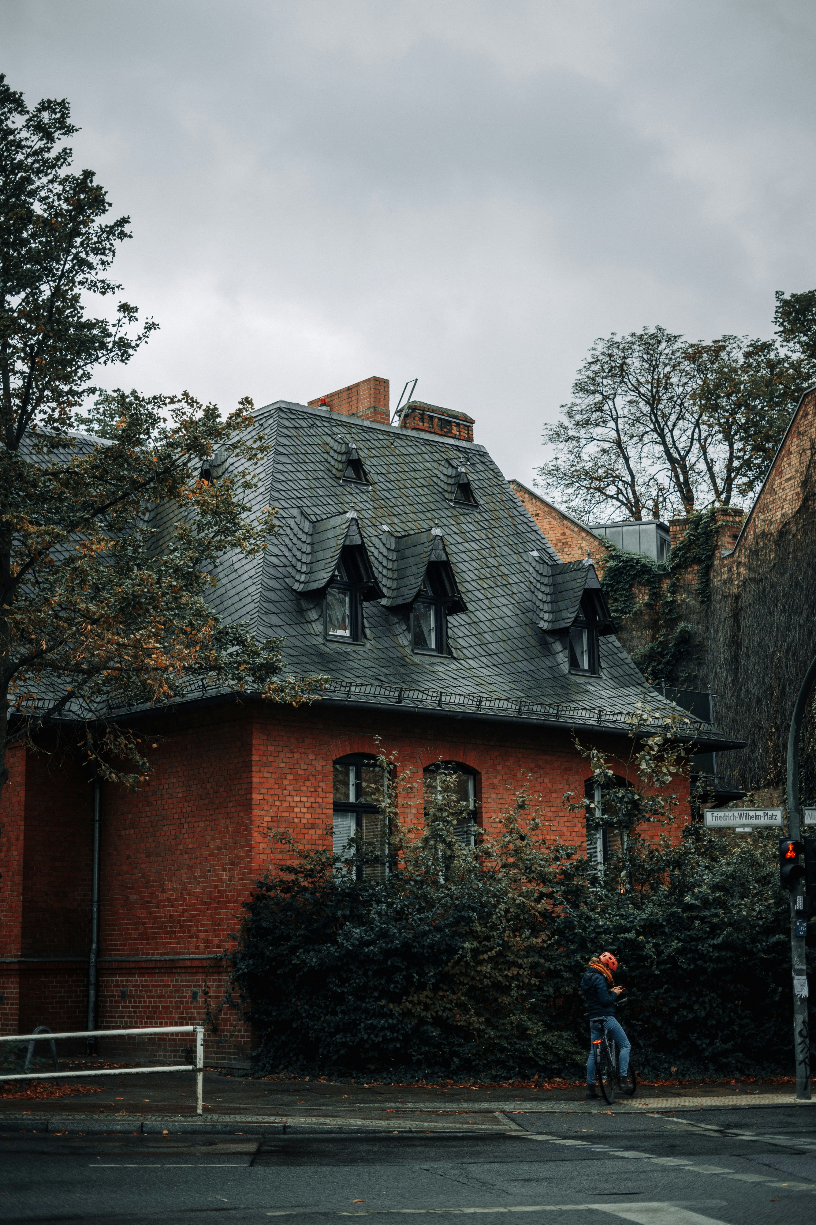 Red Brick Quiet: A Street-Corner Moment Under Slate Rooftops