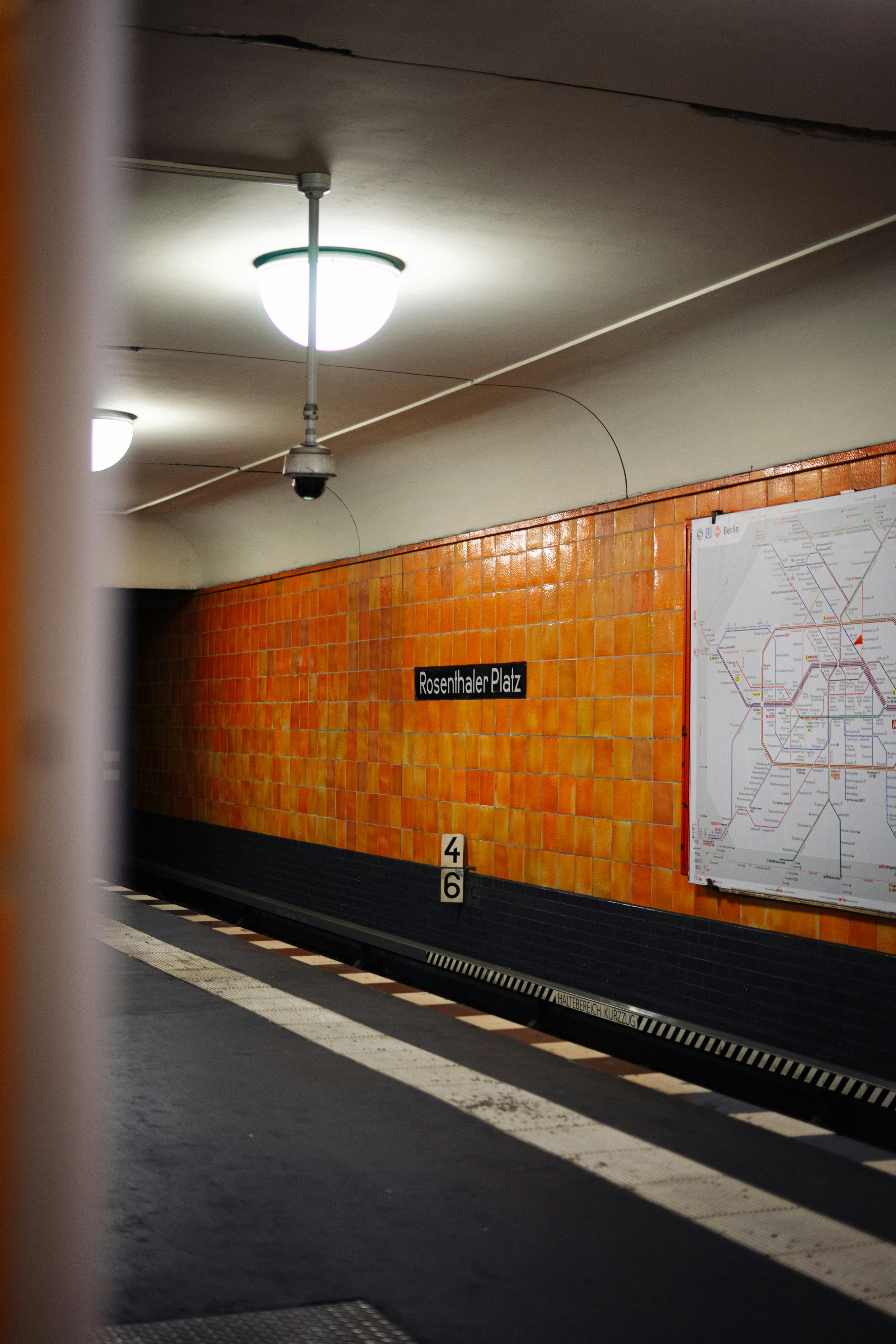 A subway station with a subway map on the wall photo – Free Rosenthaler ...