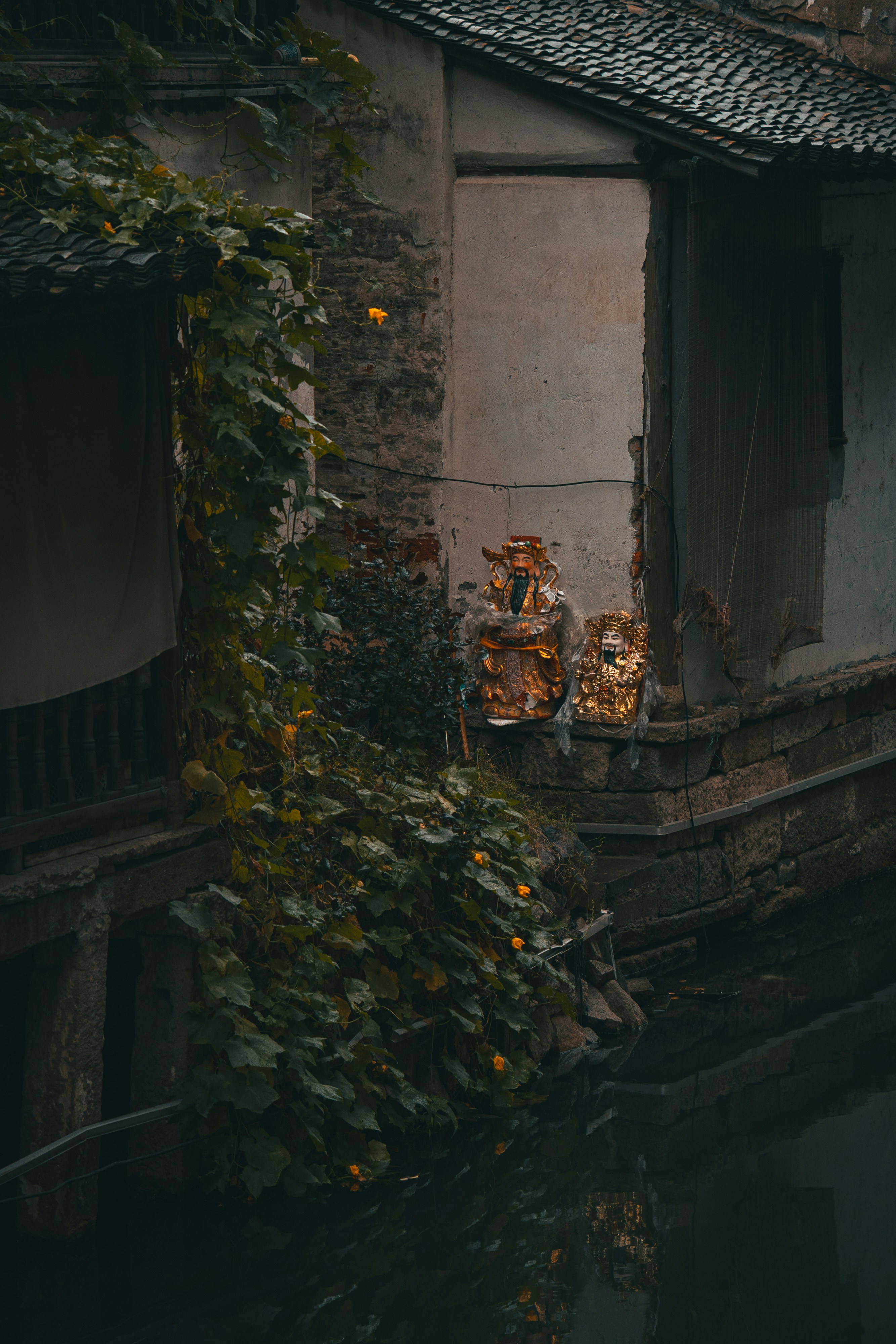 Gilded Sentinels by the Waterlogged Wall