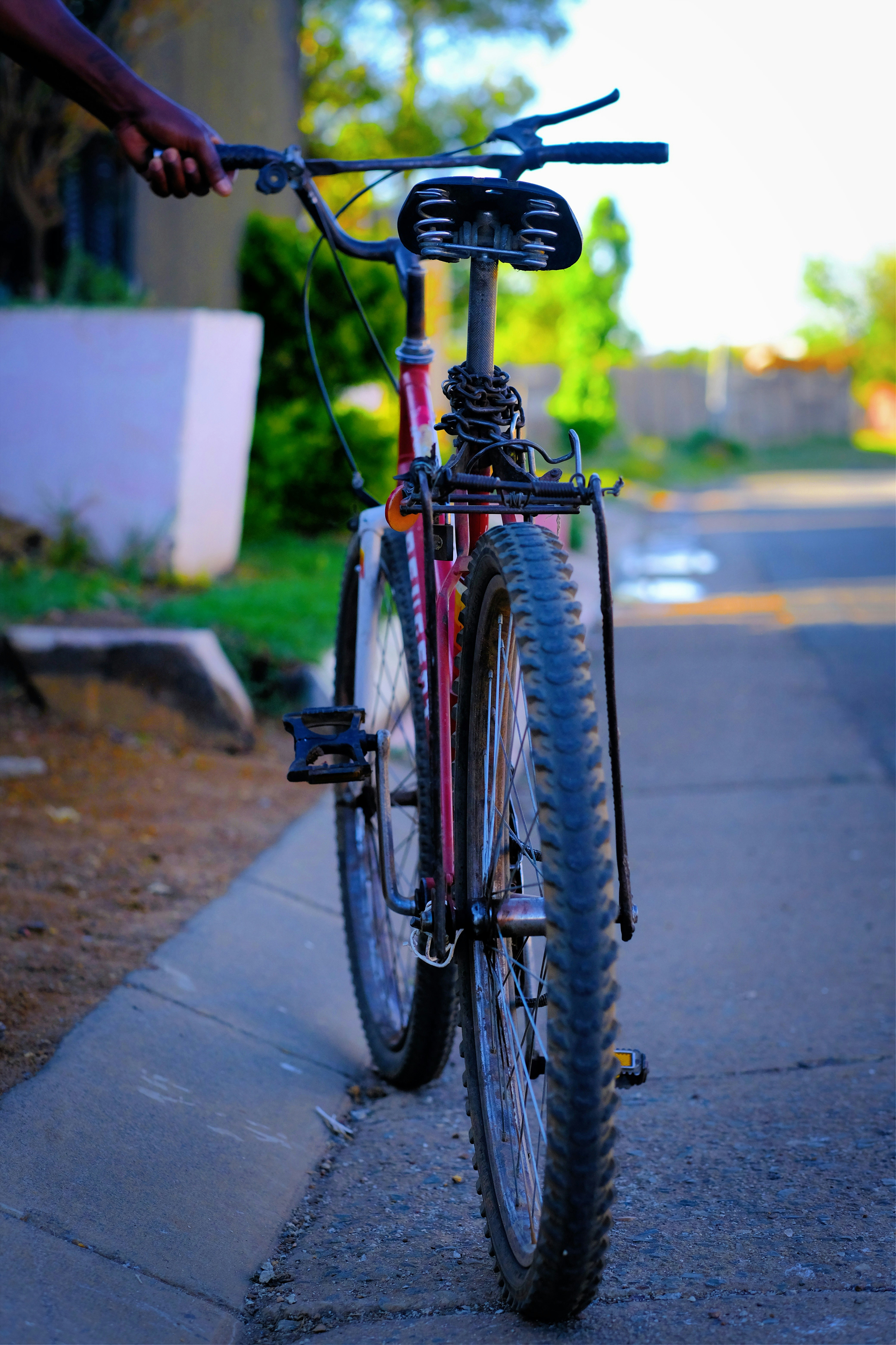 Weathered Bicycle on a Quiet Suburban Street