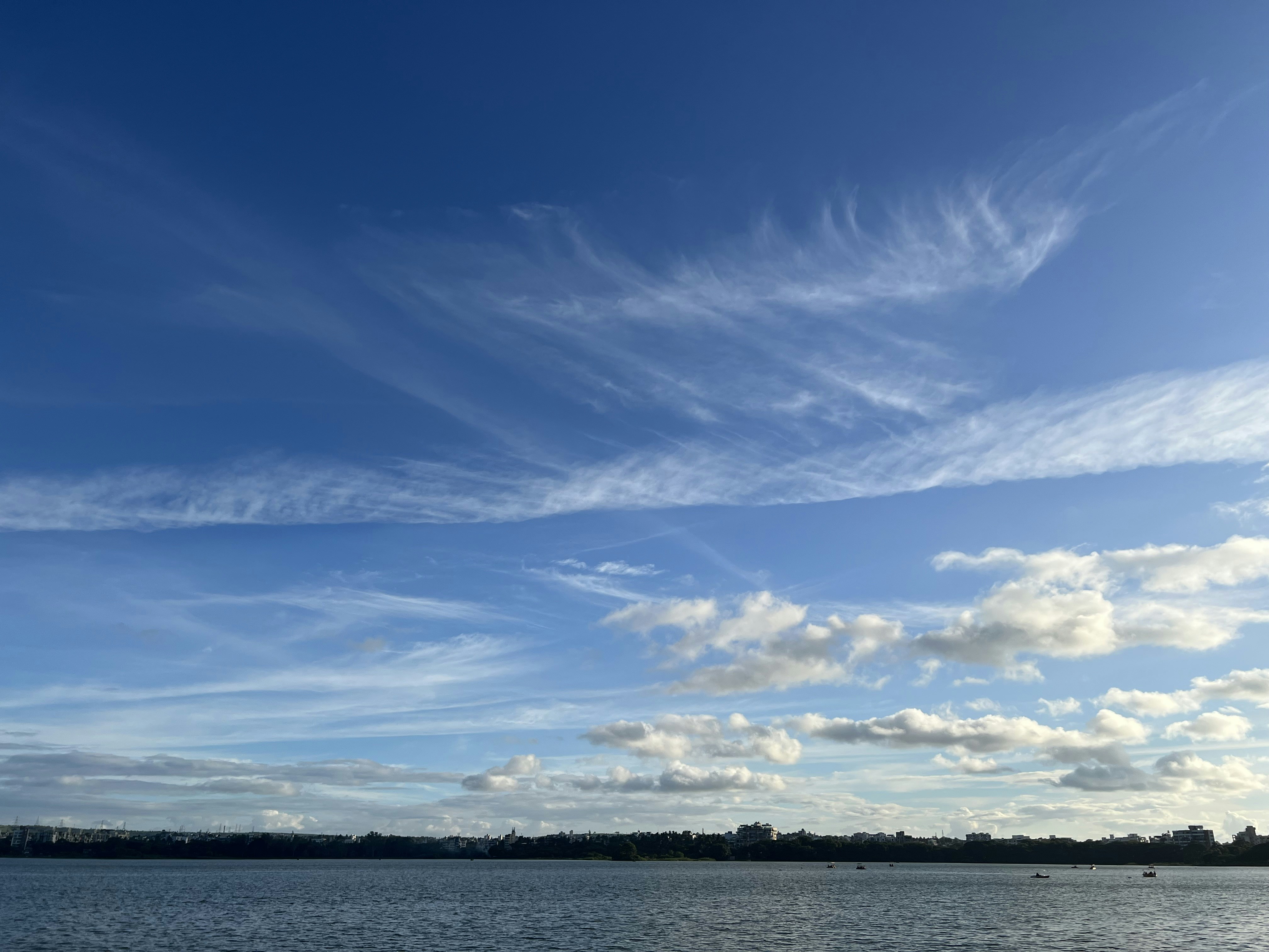 Whispering Clouds Over Tranquil Waters