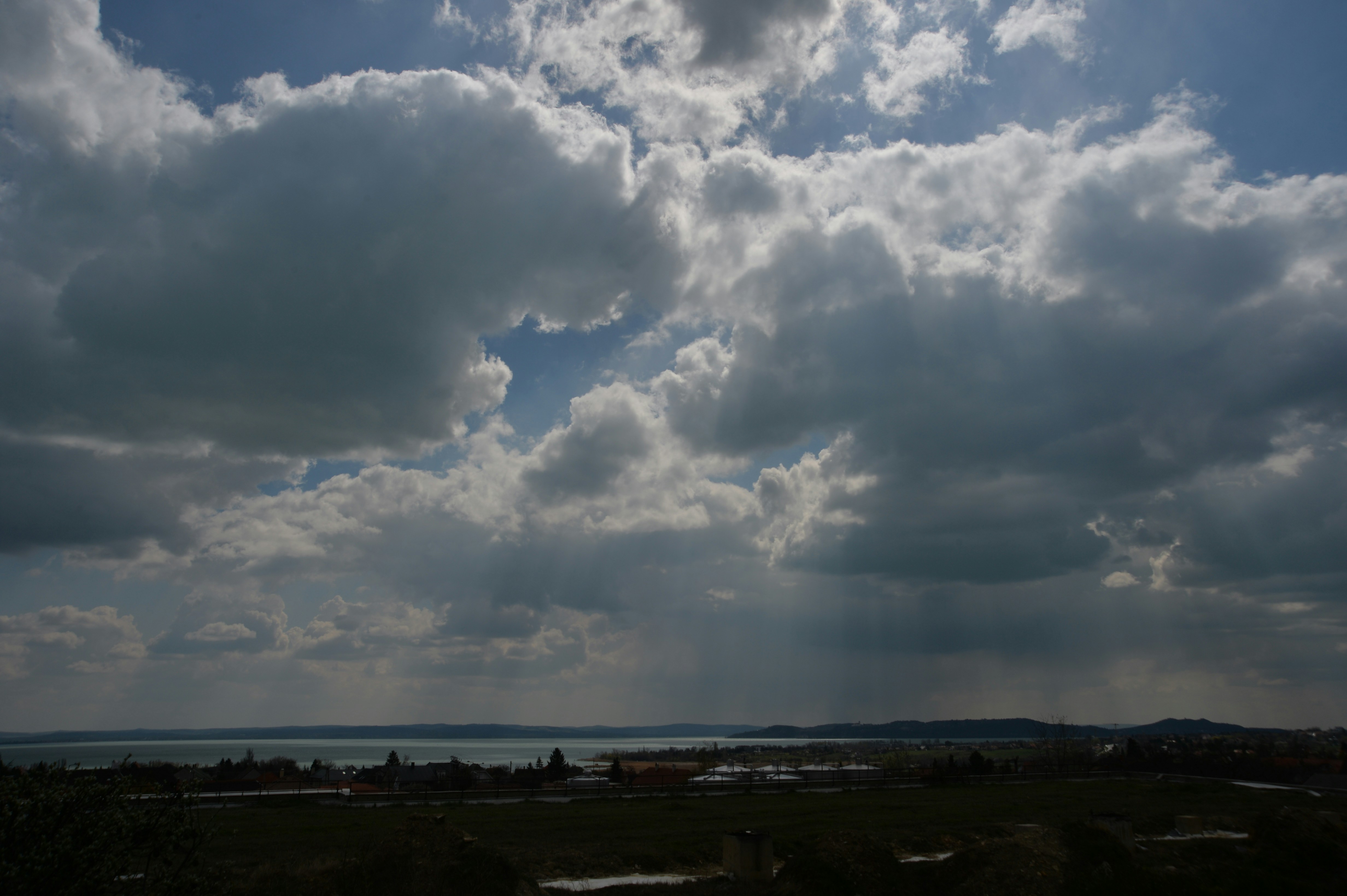 Cloudbreak Over the Coastal Plain: Sunbeams Reach a Tranquil Horizon