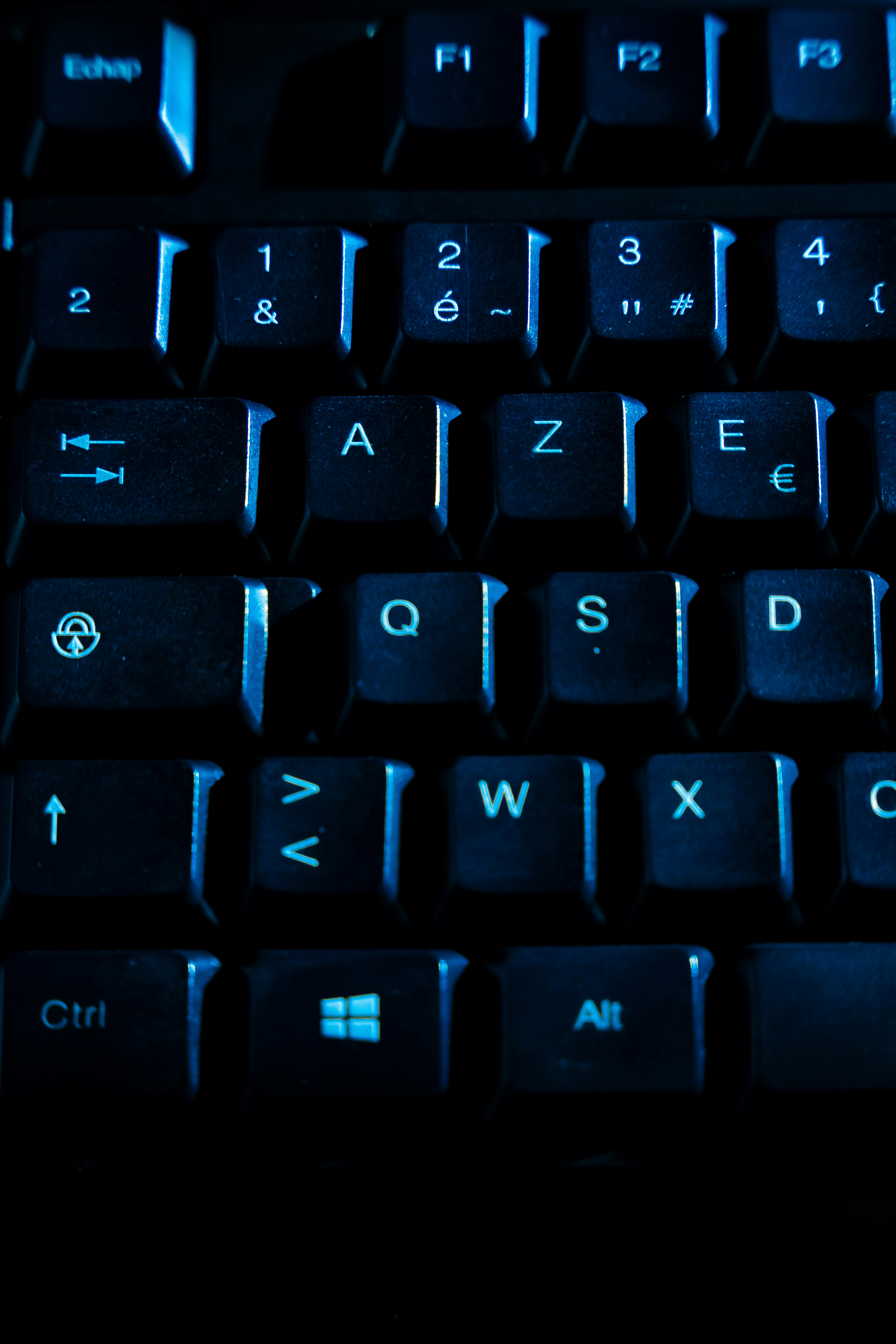 A close up of a black keyboard with blue keys photo – Free Marseille ...