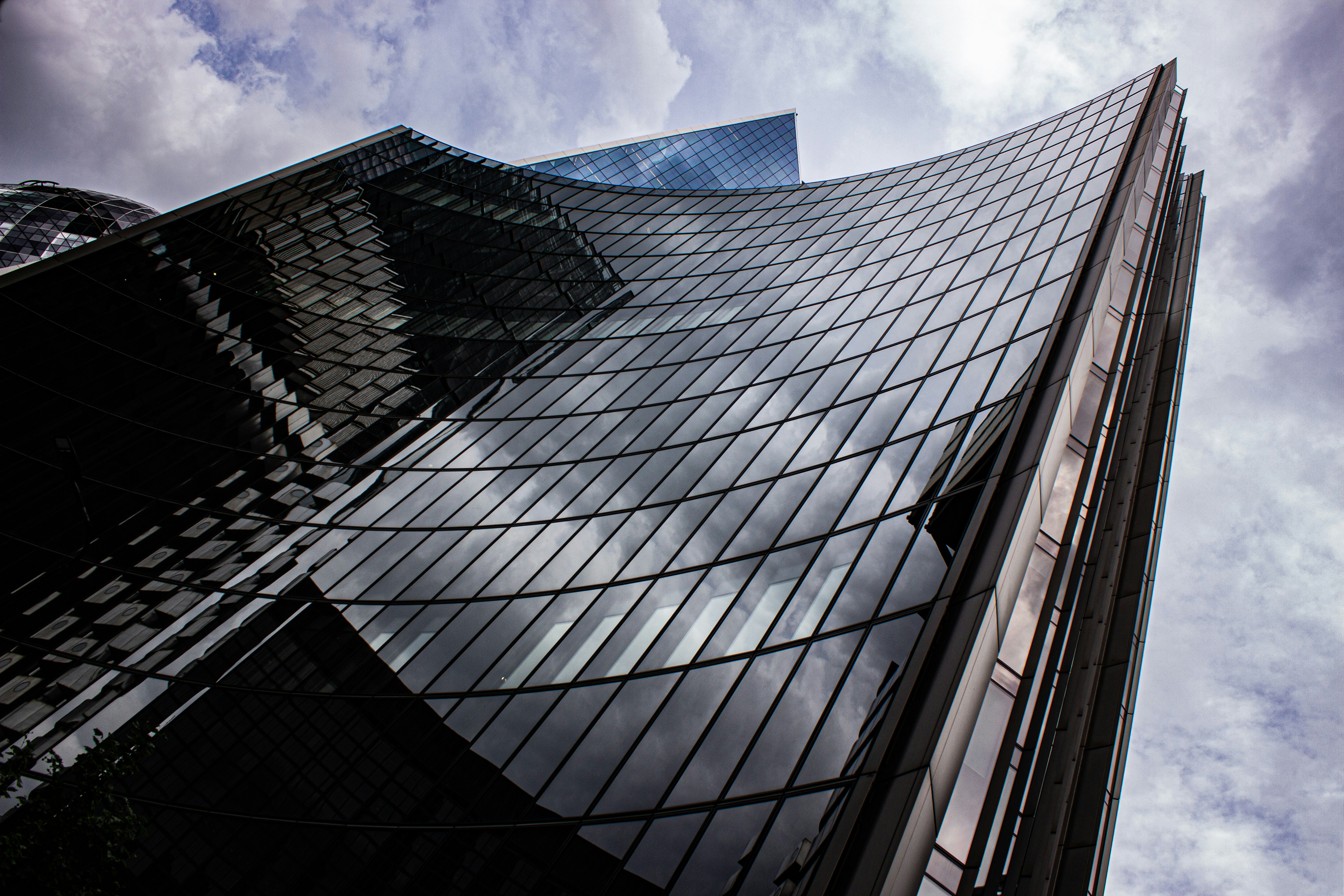 A very tall building with a lot of windows photo – Free Office Image on ...