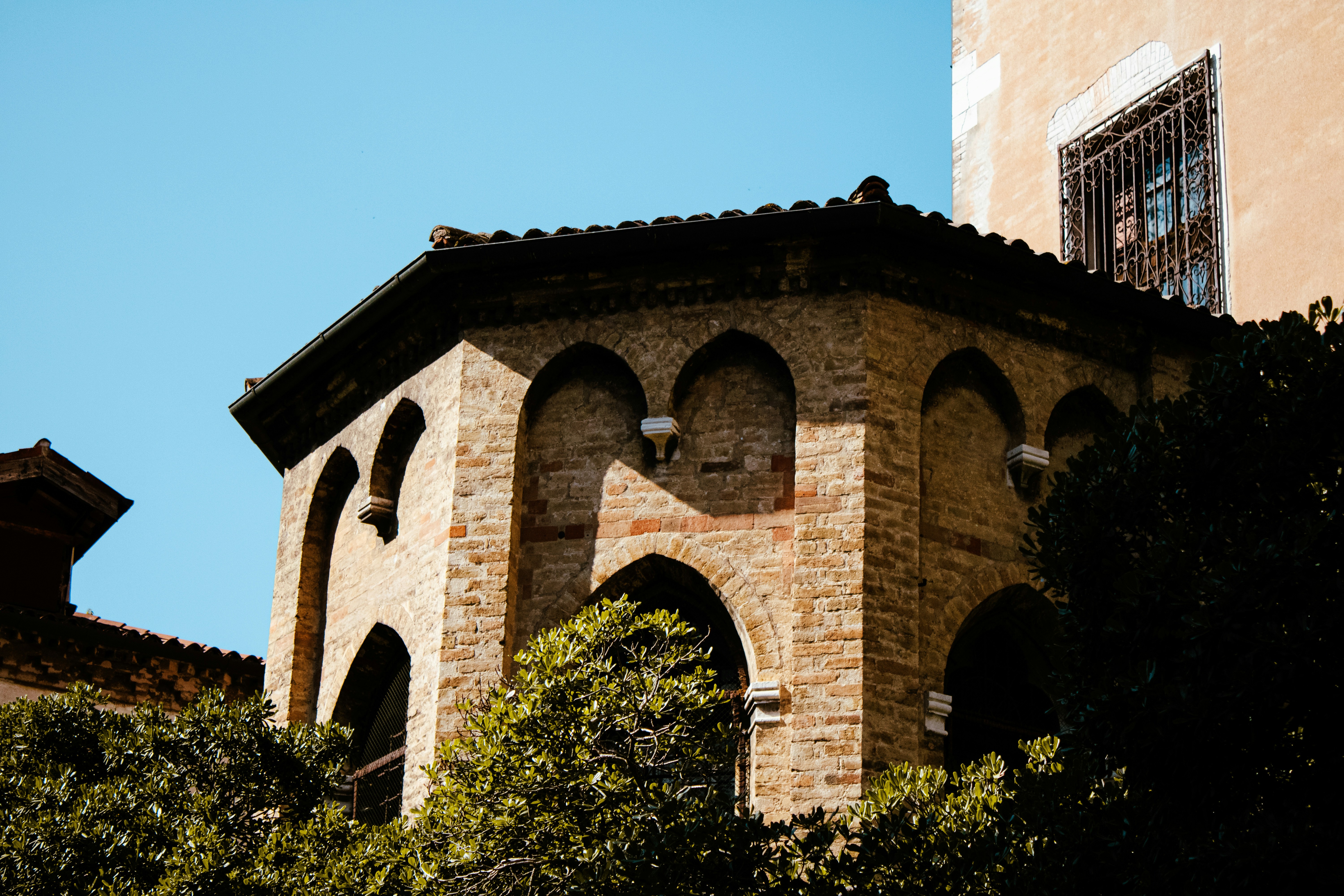A tall building with a clock on the side of it photo – Free Venezia ...