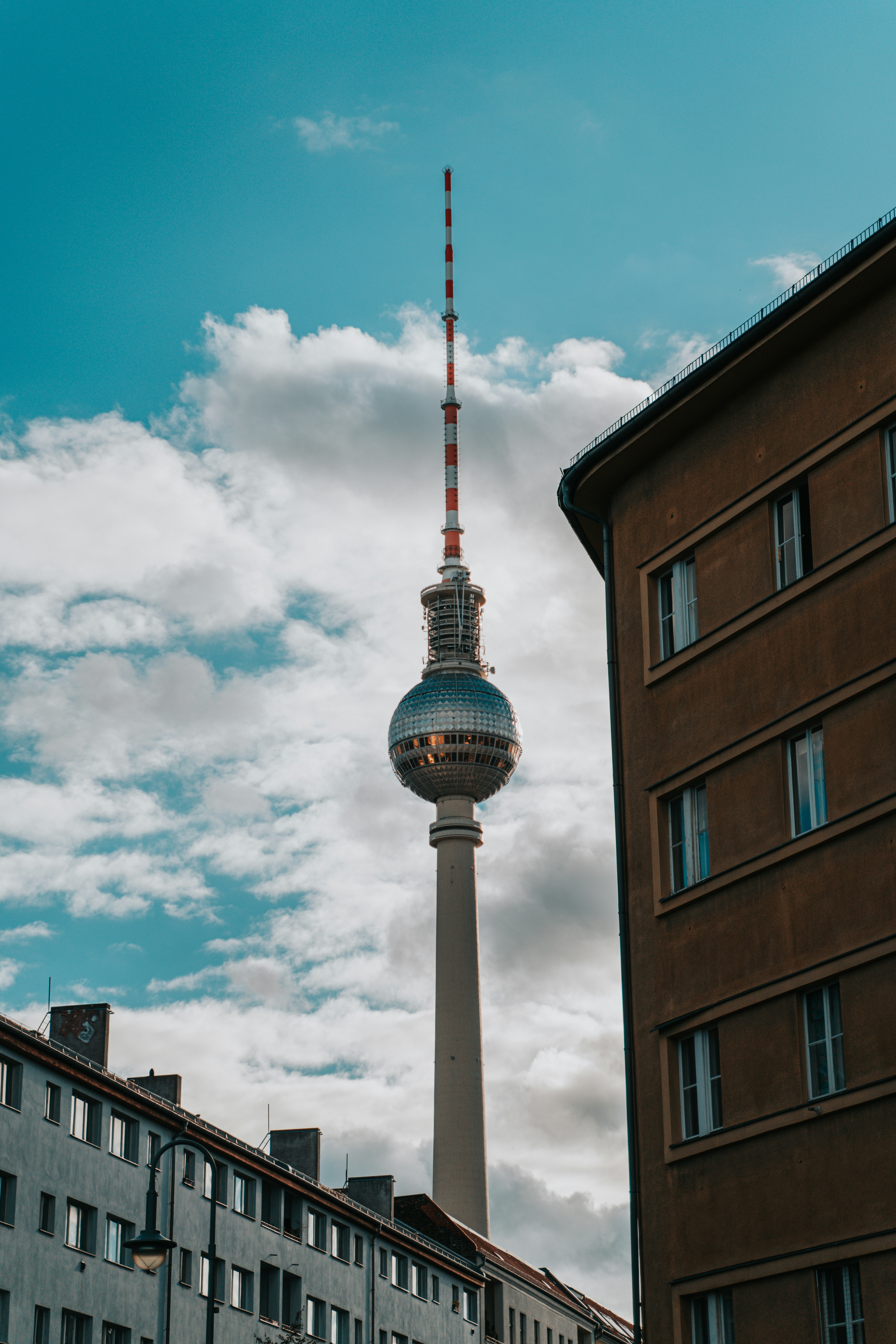Signal Needle Over Berlin: Fernsehturm Rising Behind Urban Facades