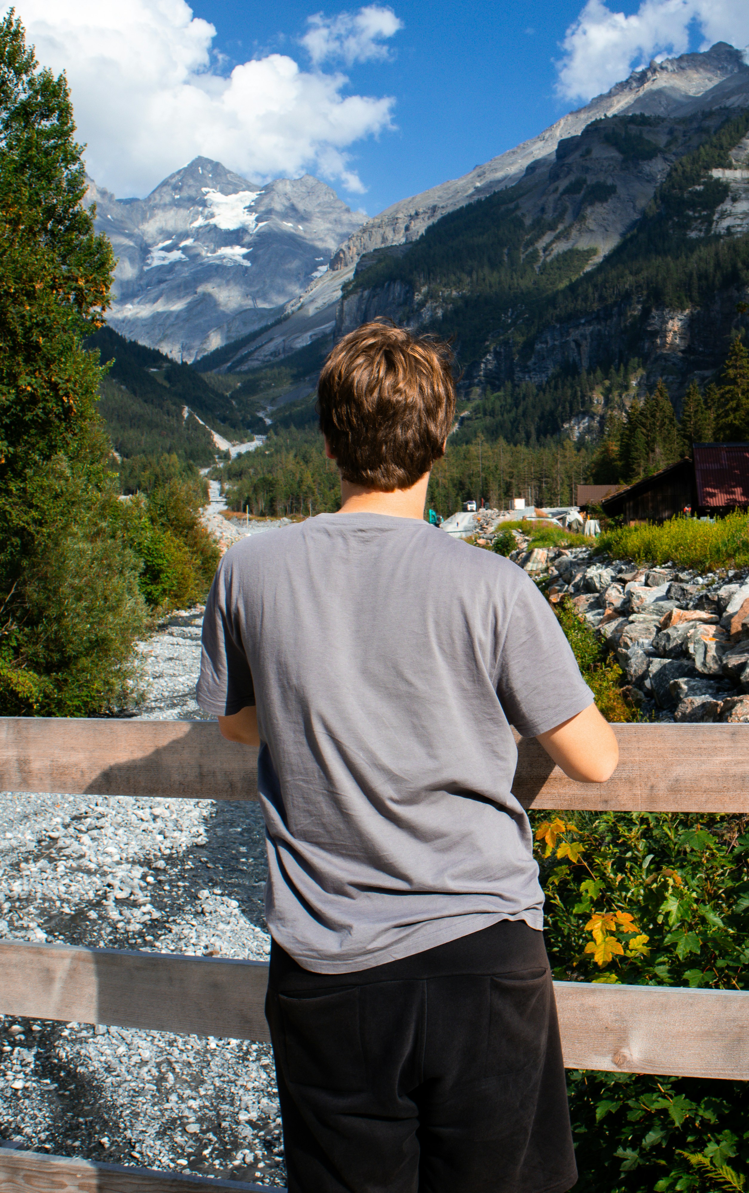 Trailhead Reverie: A Figure Contemplates the Alpine Expanse