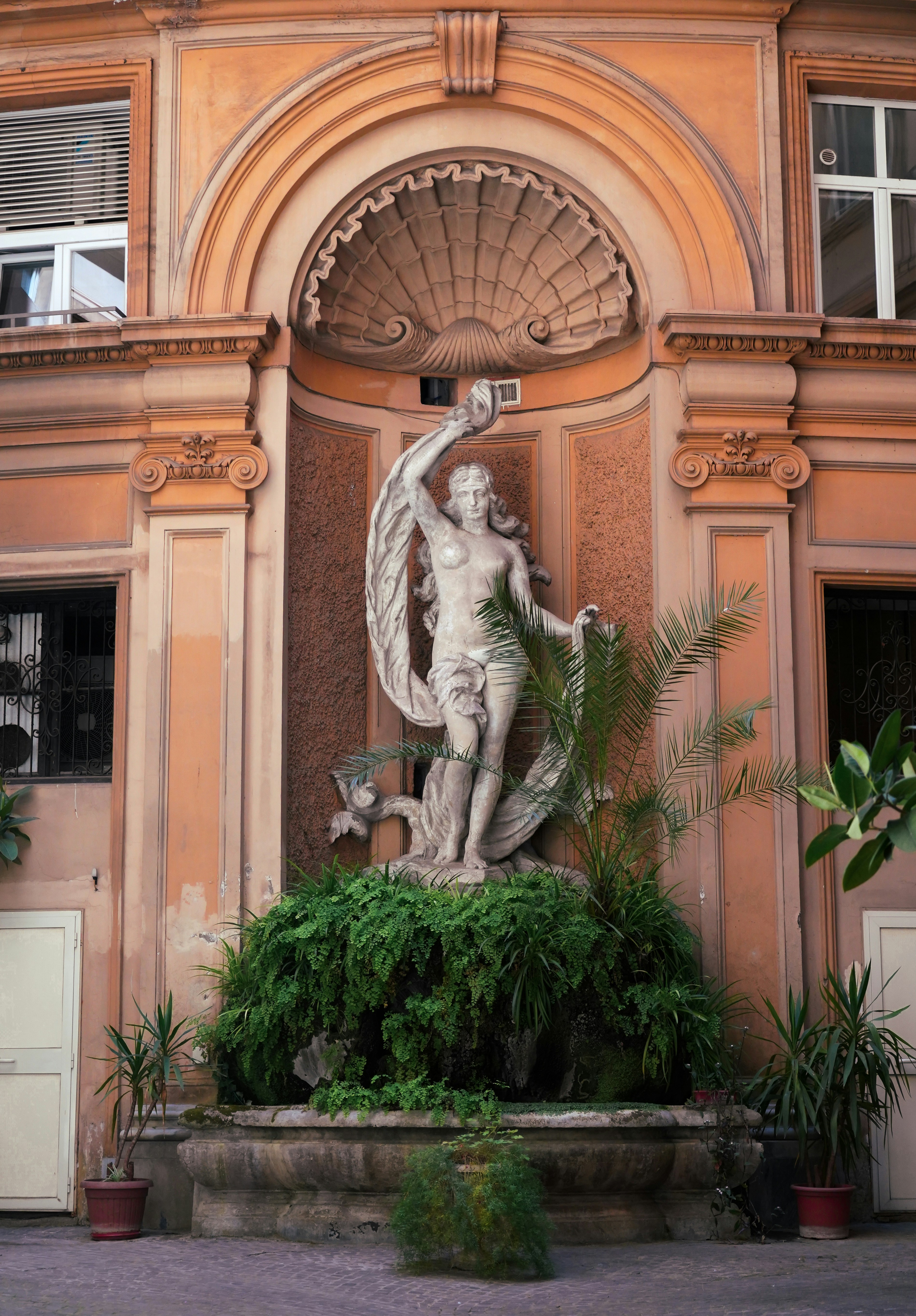 Marble Sentinel Beneath Terracotta Arches