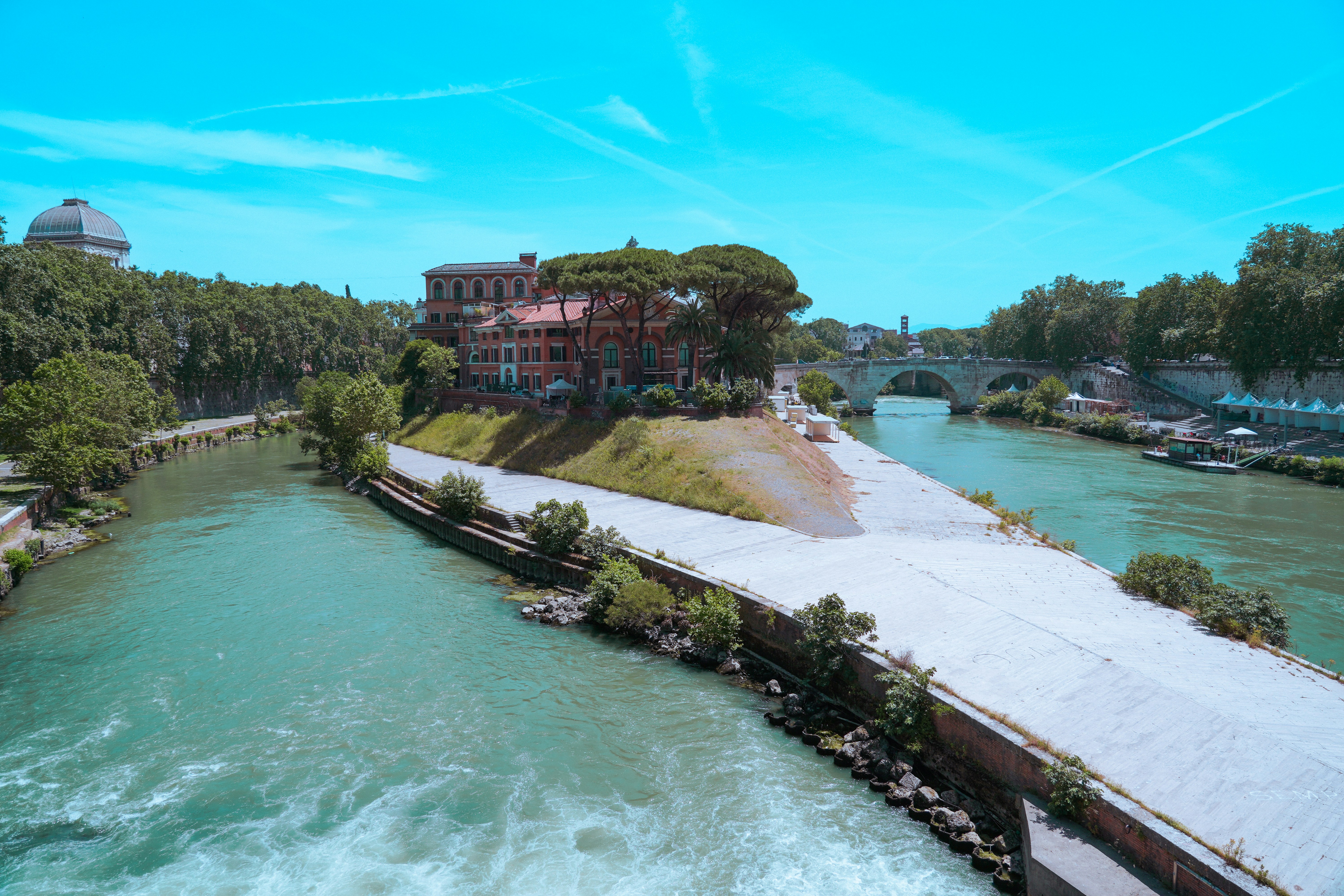 Red-Brick Haven at River's End, Linked by a White Stone Causeway