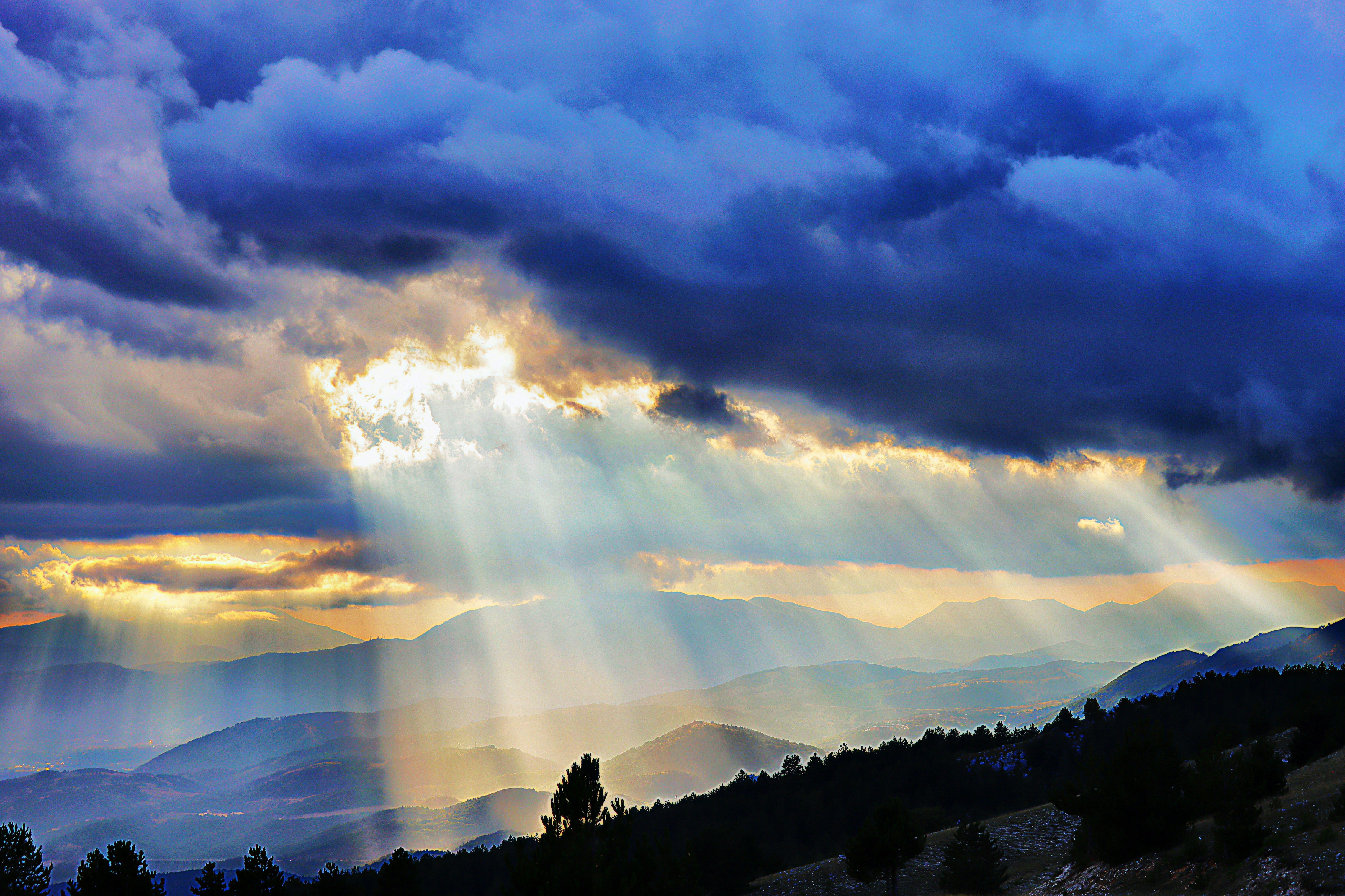 Sun Rays Coming Through Clouds Wallpaper