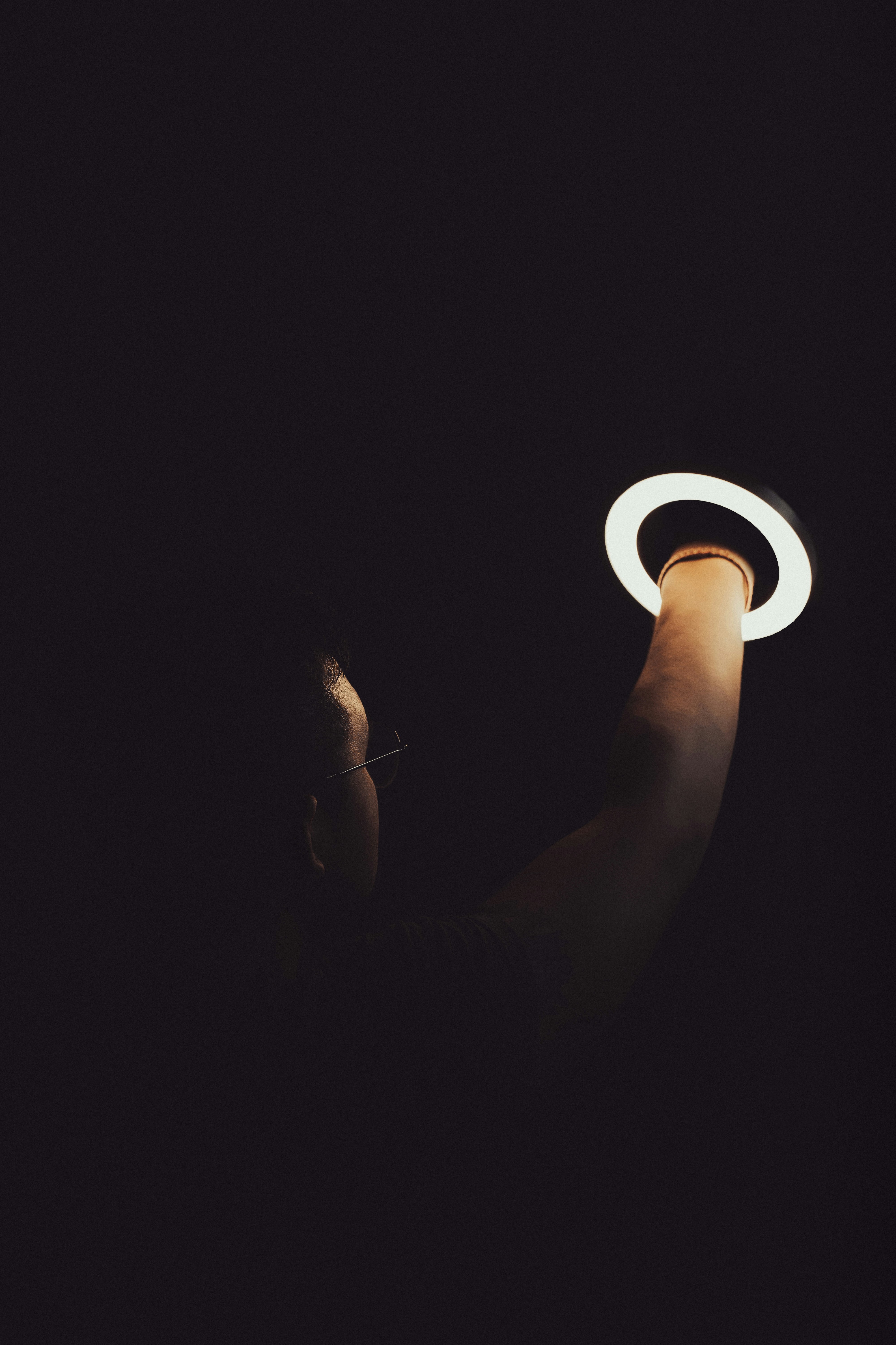 A person holding a lit object in the dark photo – Free Lighting Image ...