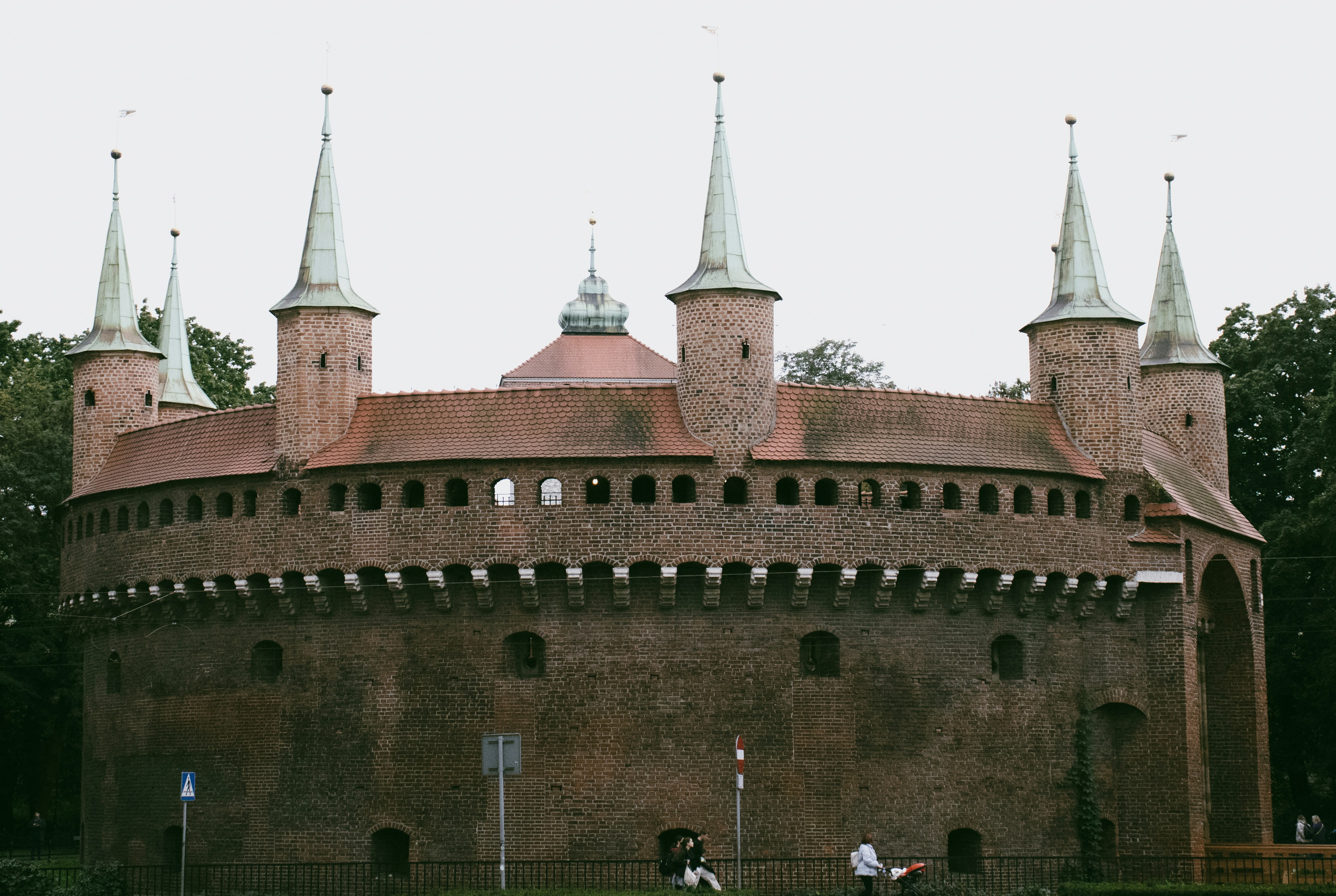 Fortress Crown: Circular Brick Bastion Framed by Conical Turrets