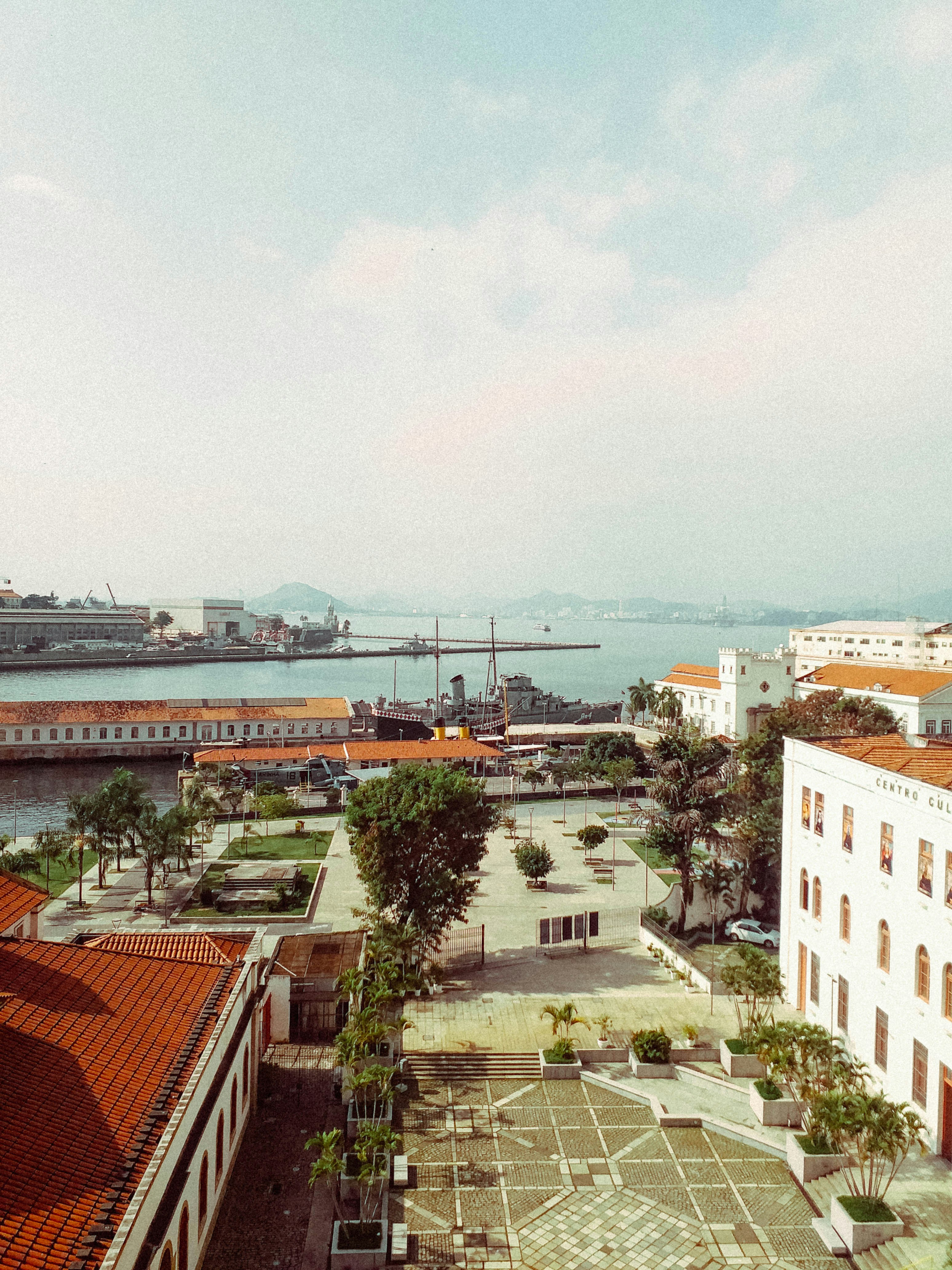 Harbor Courtyard: A Sunlit City From Rooftop Vantage
