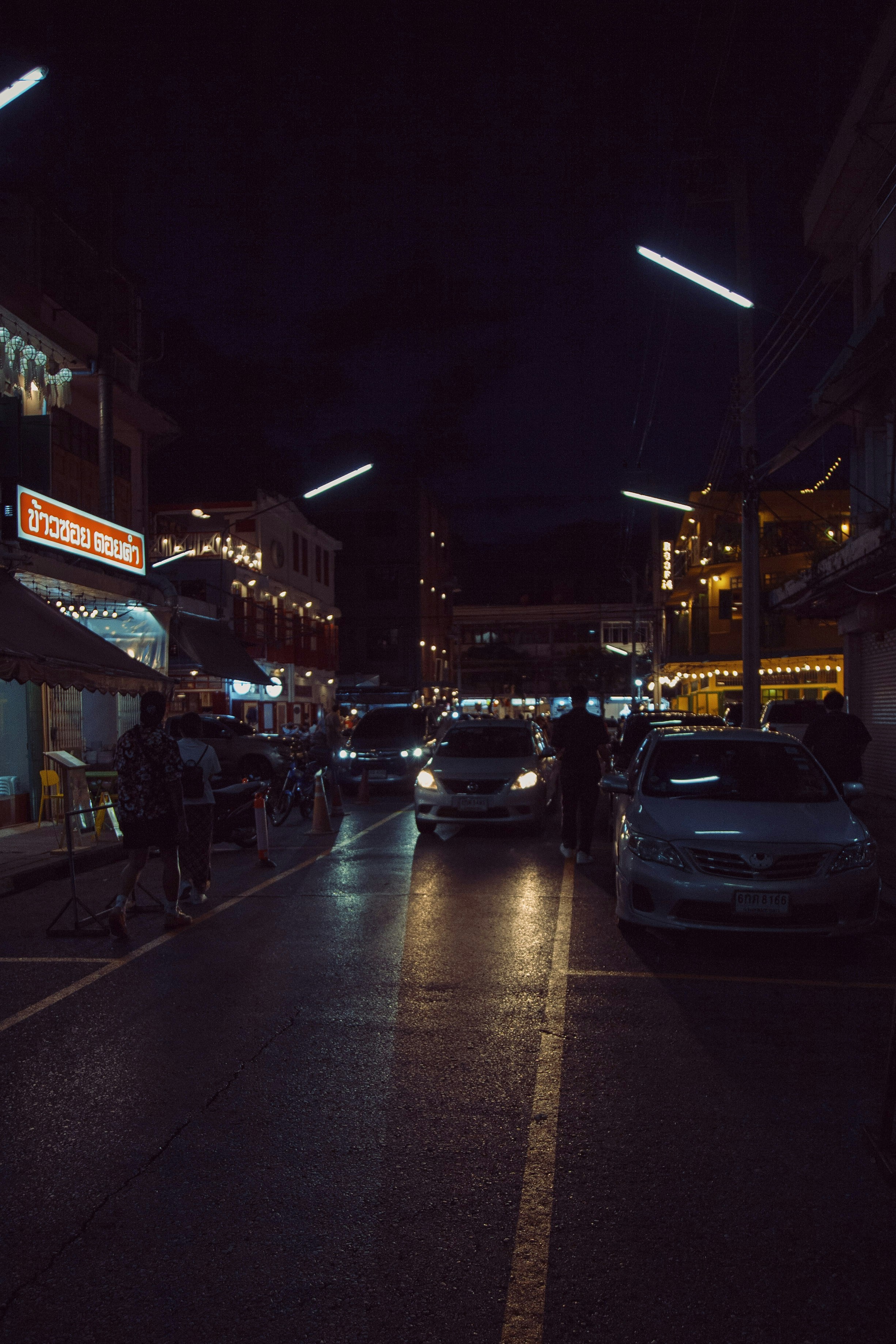 Neon Pulse on a Rain-Slick Thai Street