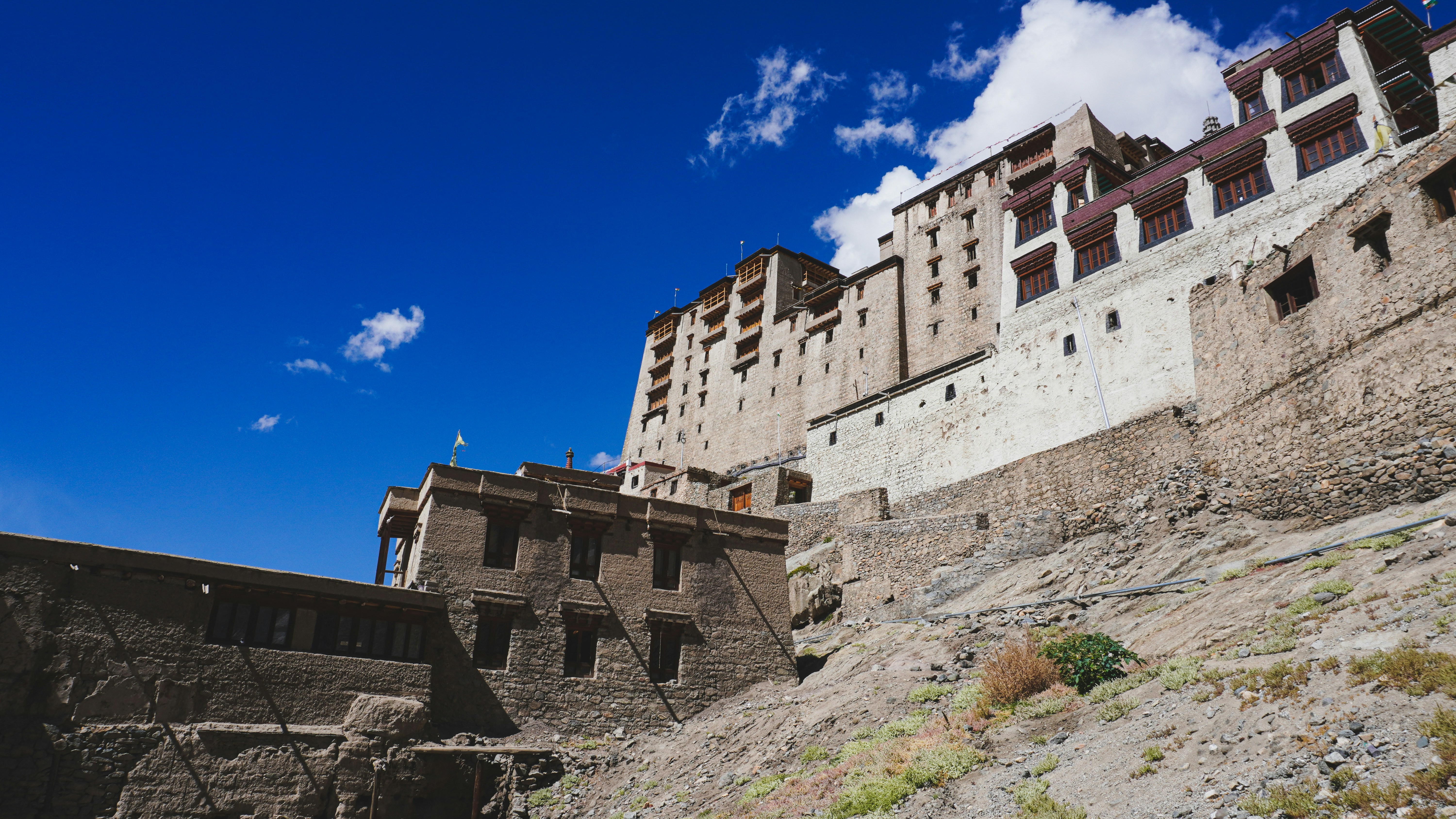 Cliffside Citadel under Cerulean Skies: A Fortress Carved into the Slope