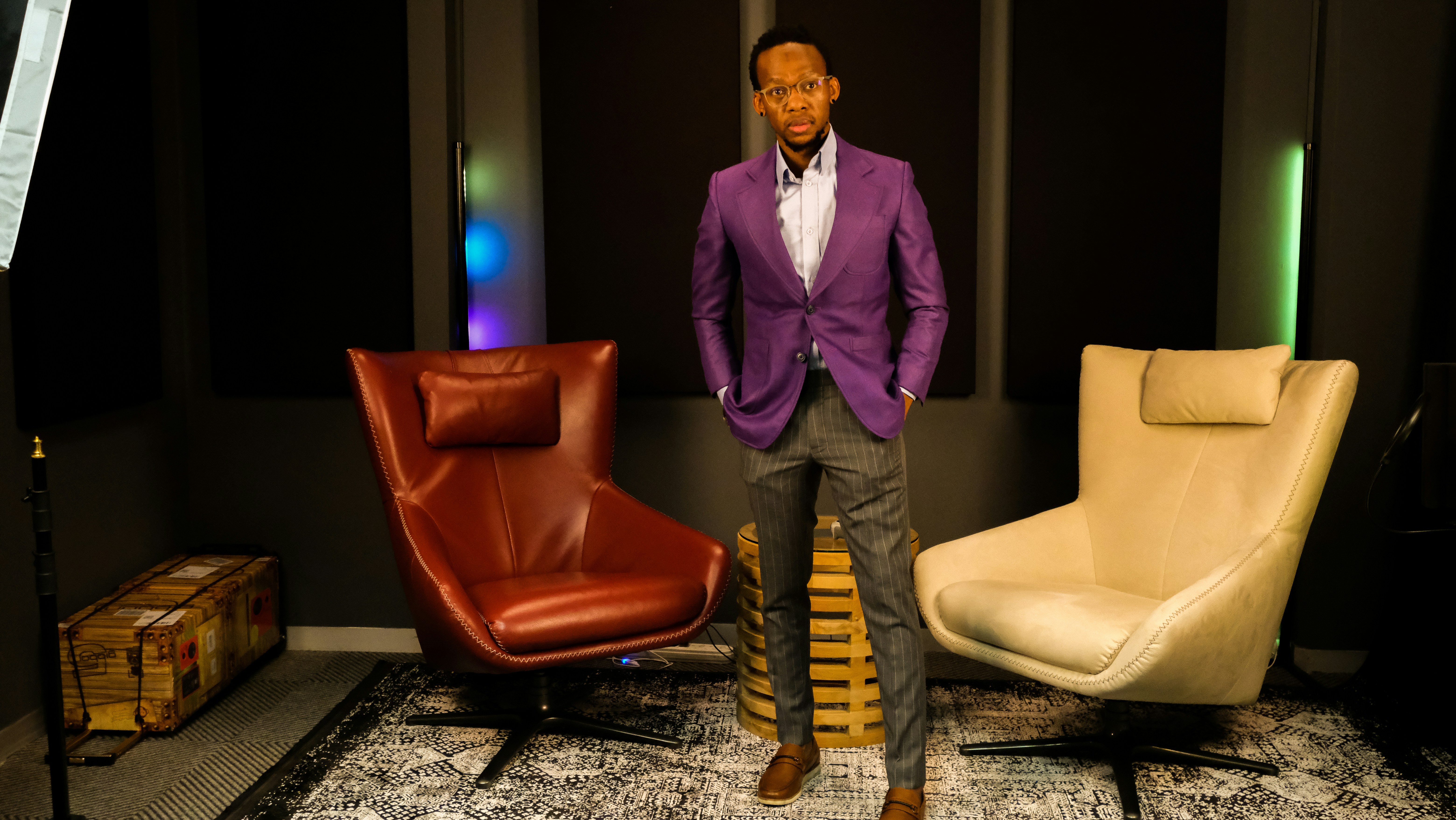 Purple Velvet Presence: A Studio Portrait with Neon Backdrop