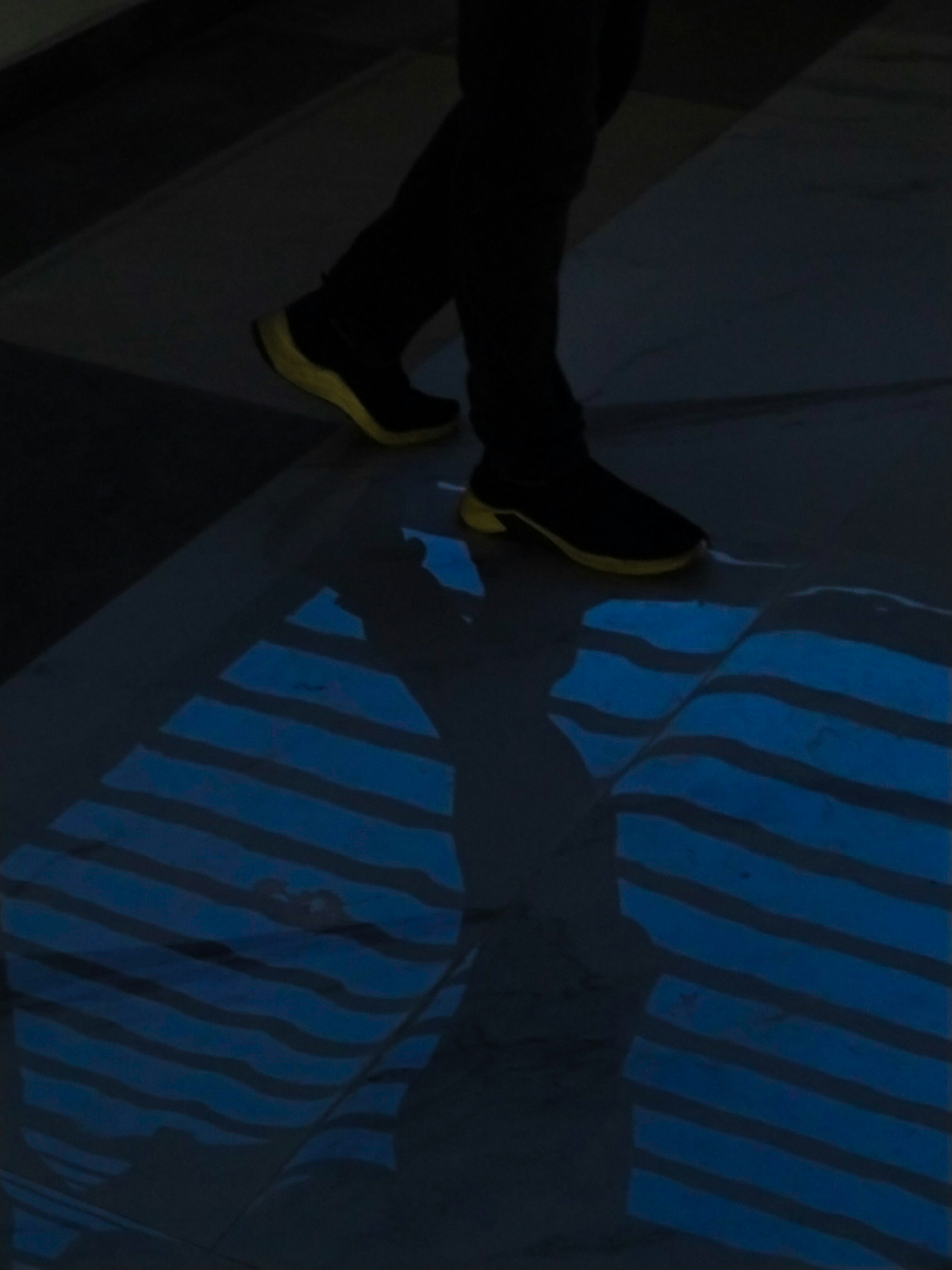 Footsteps on Tinted Water: A Dance of Shadow and Light