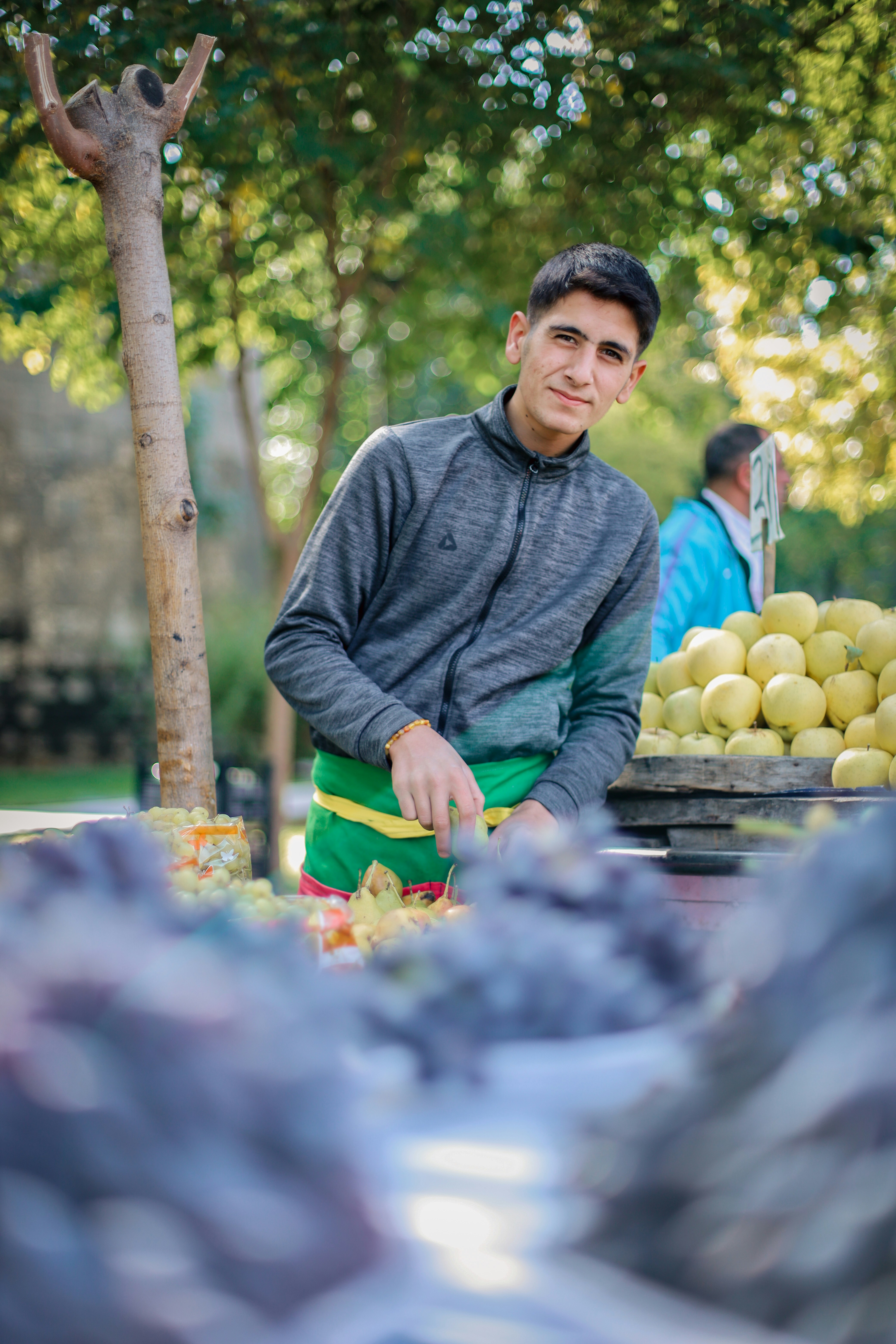 Market Vendor with Citrus Comfort: A Portrait in Motion