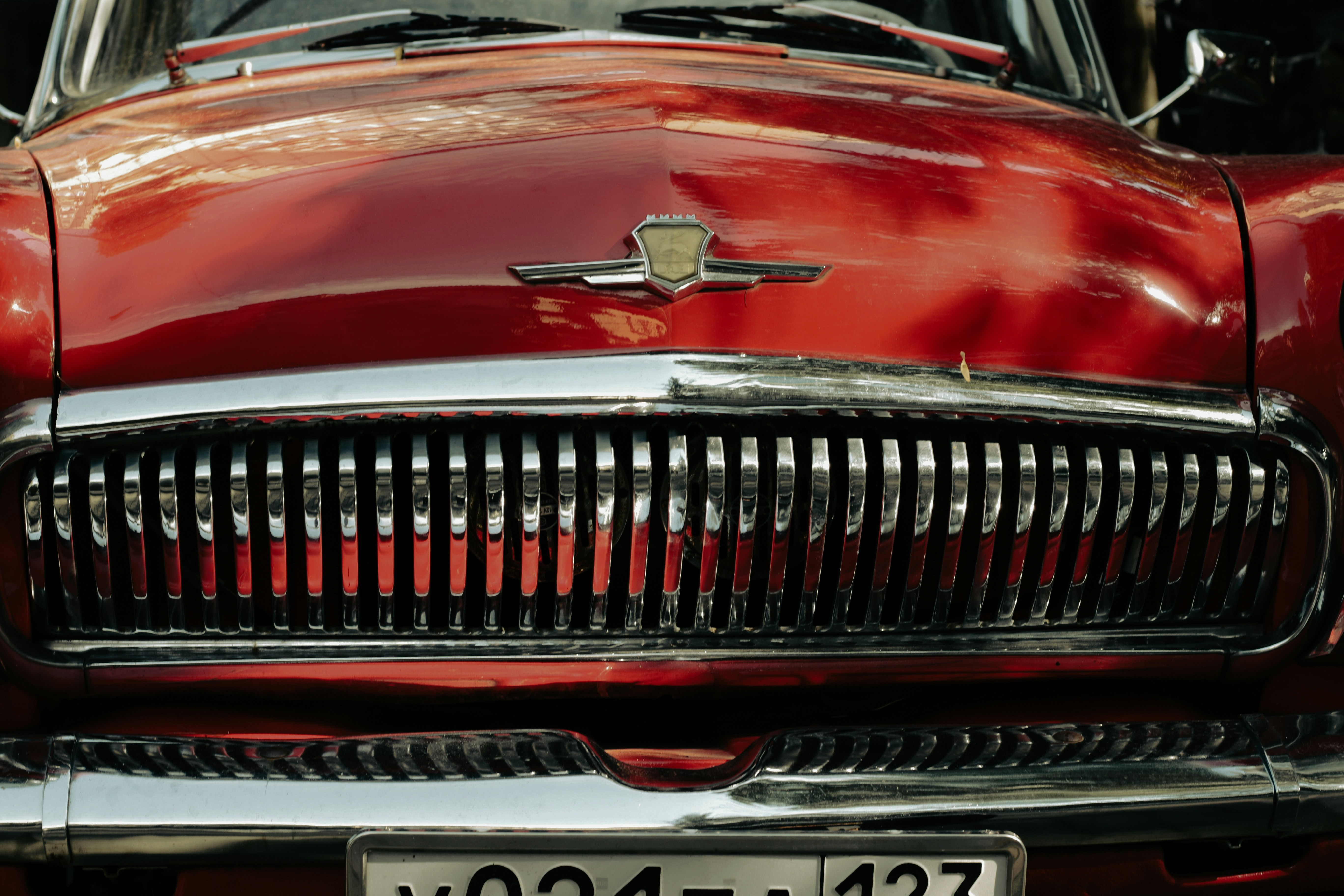 Chrome Grille Portrait: A Vintage Red Front Scene