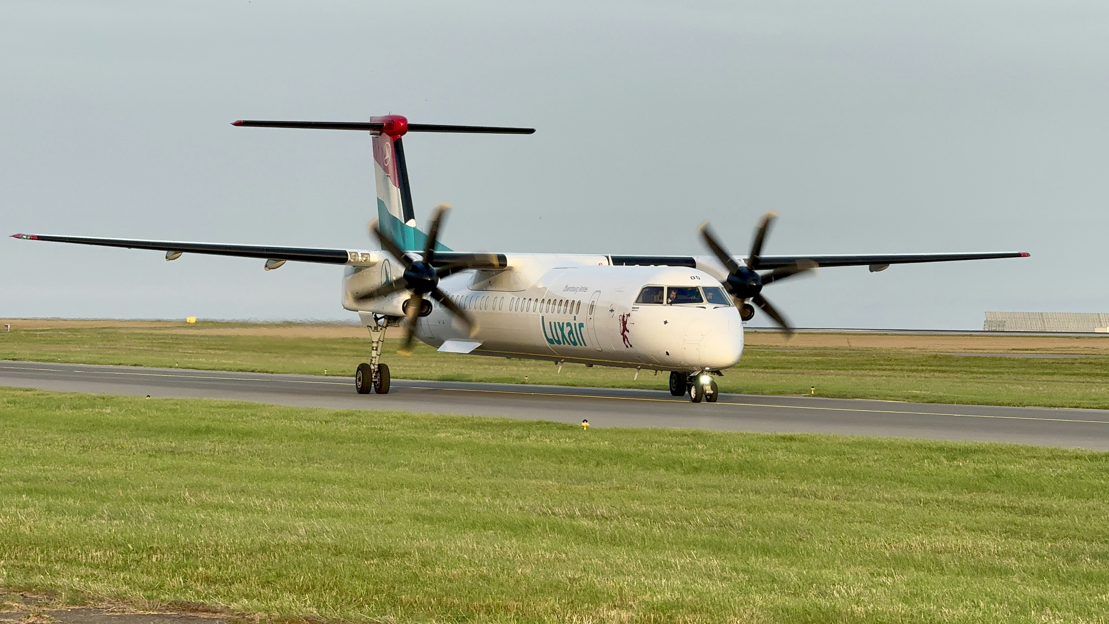 A large white airplane on a run way photo – Free Lux airport Image on ...