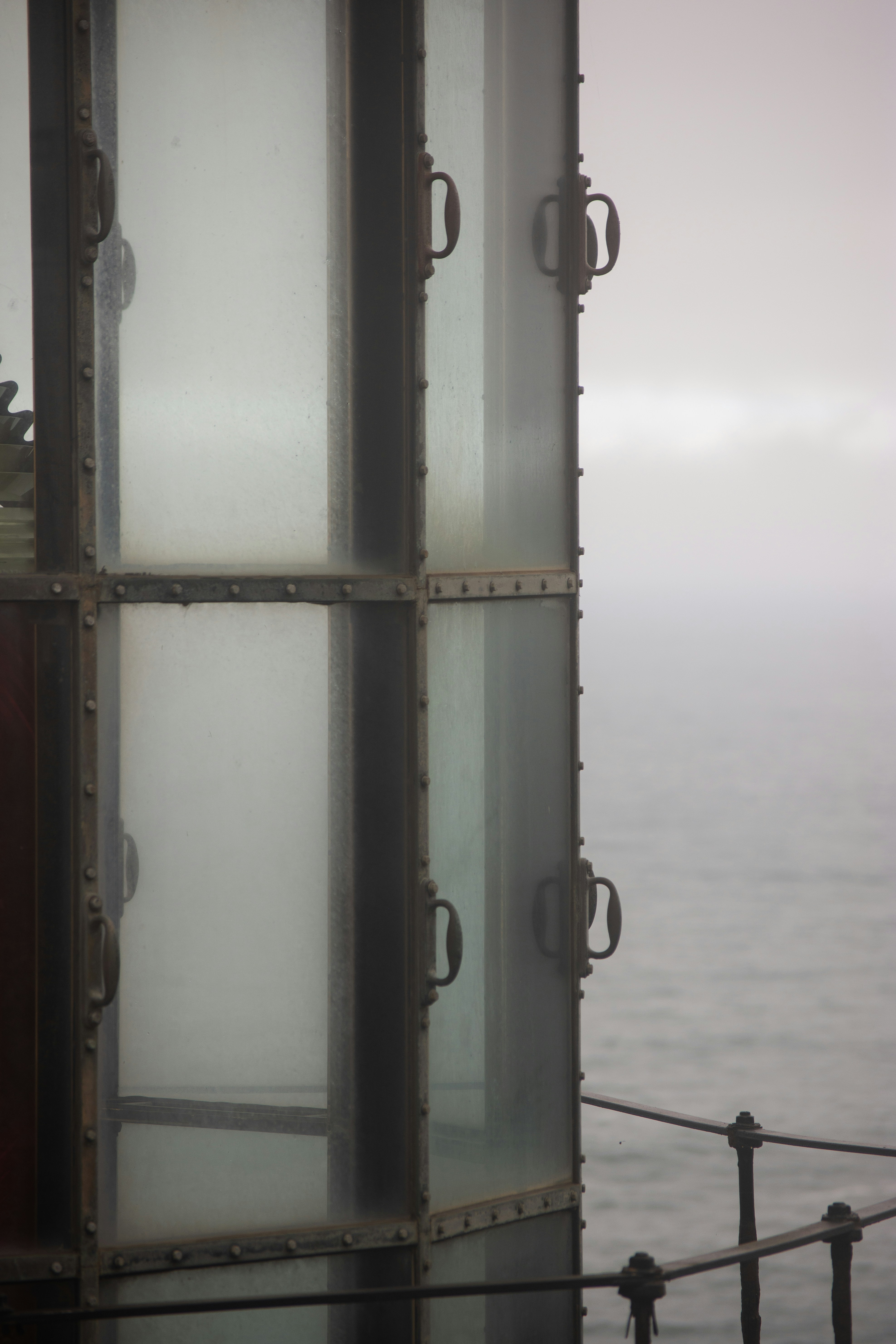 Cape Meares Lighthouse in it's steel-rivited glory. Standing firm against the bashing waves of the dramatic Oregon coast. Defiant.