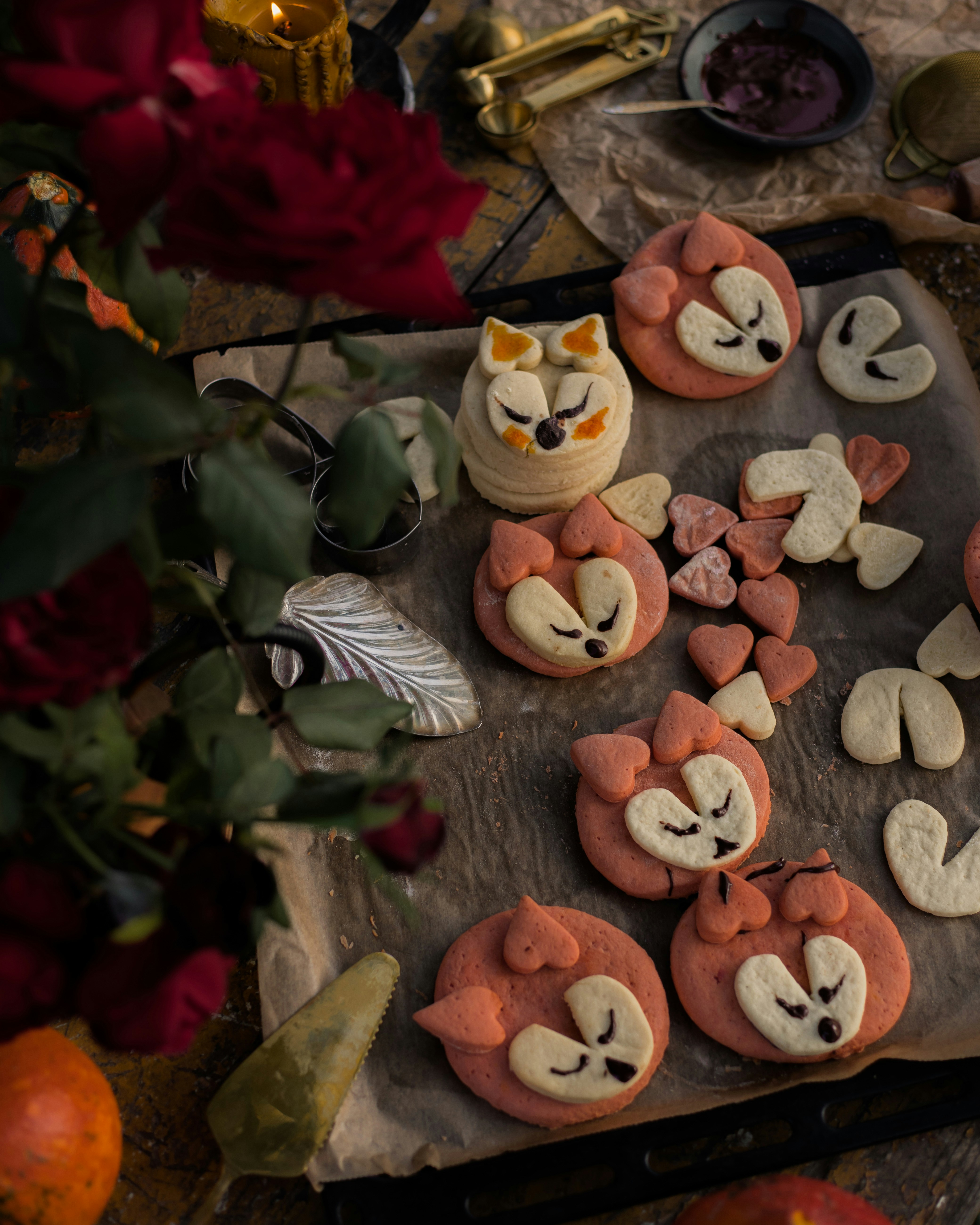 Fox-Faced Cookies on a Weathered Board Beneath Velvet Rose Light