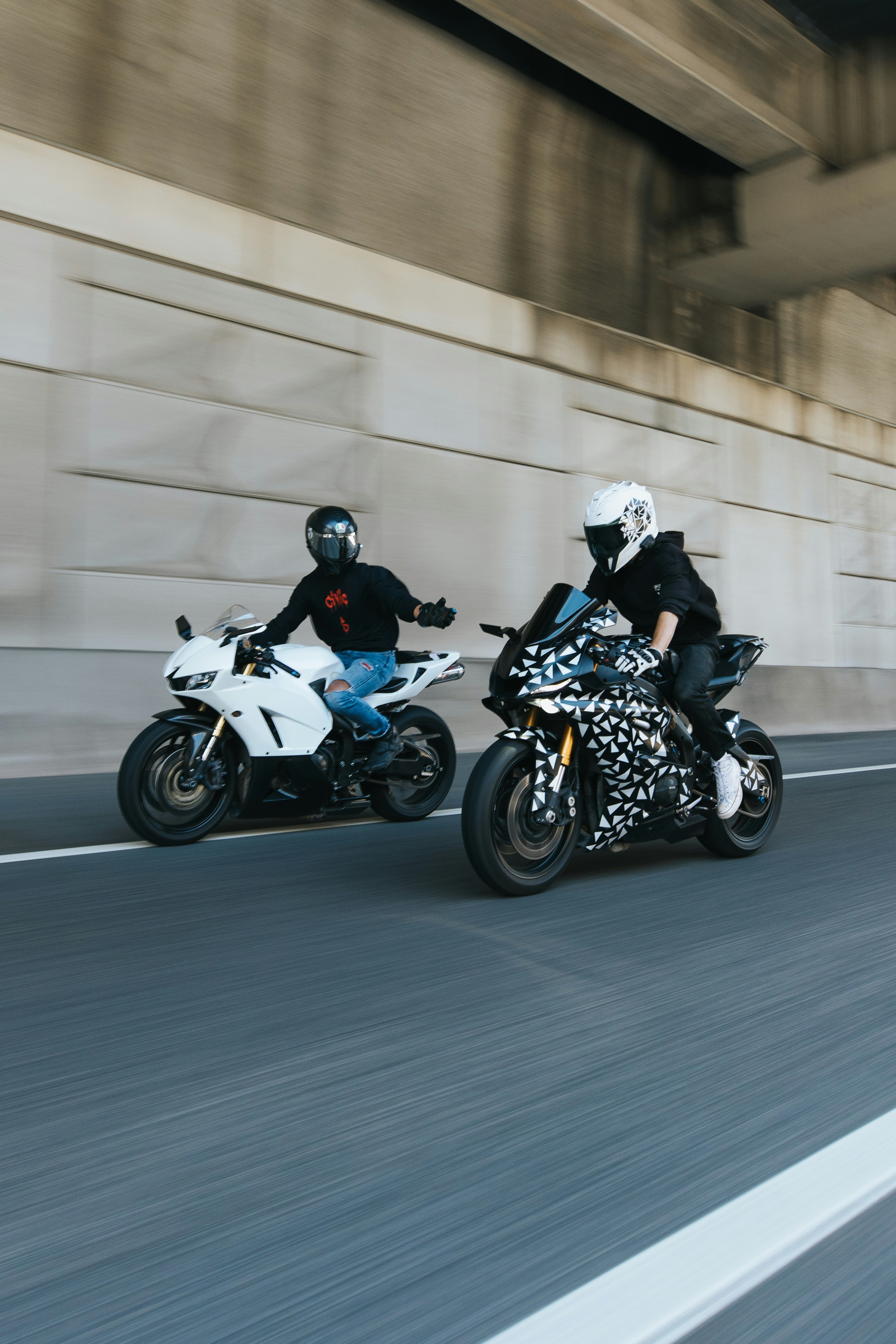 Two people riding motorcycles on a city street photo – Free Grey Image ...