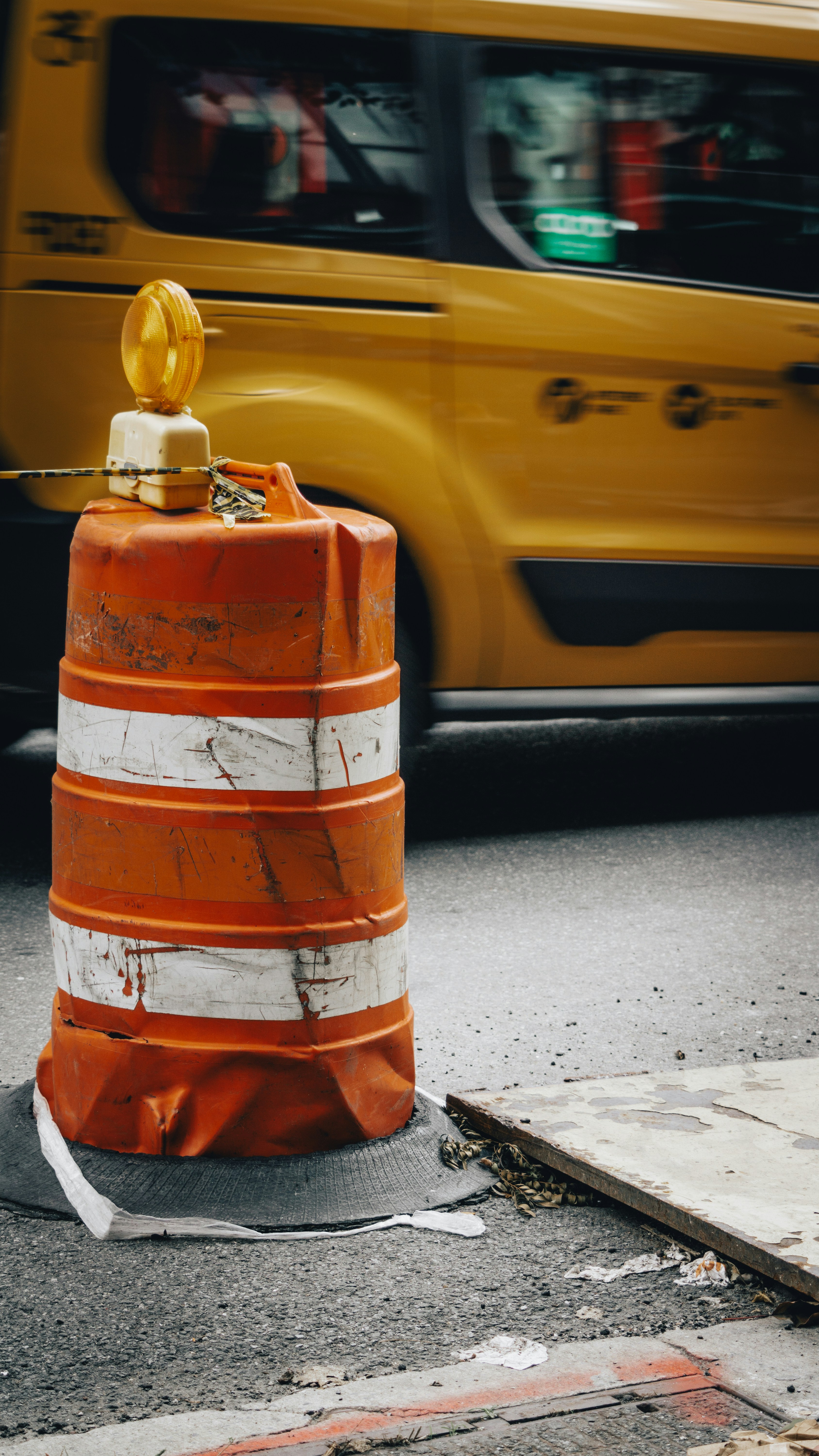 Orange Barrier in Motion: A Street-Side Study of Transit and Texture