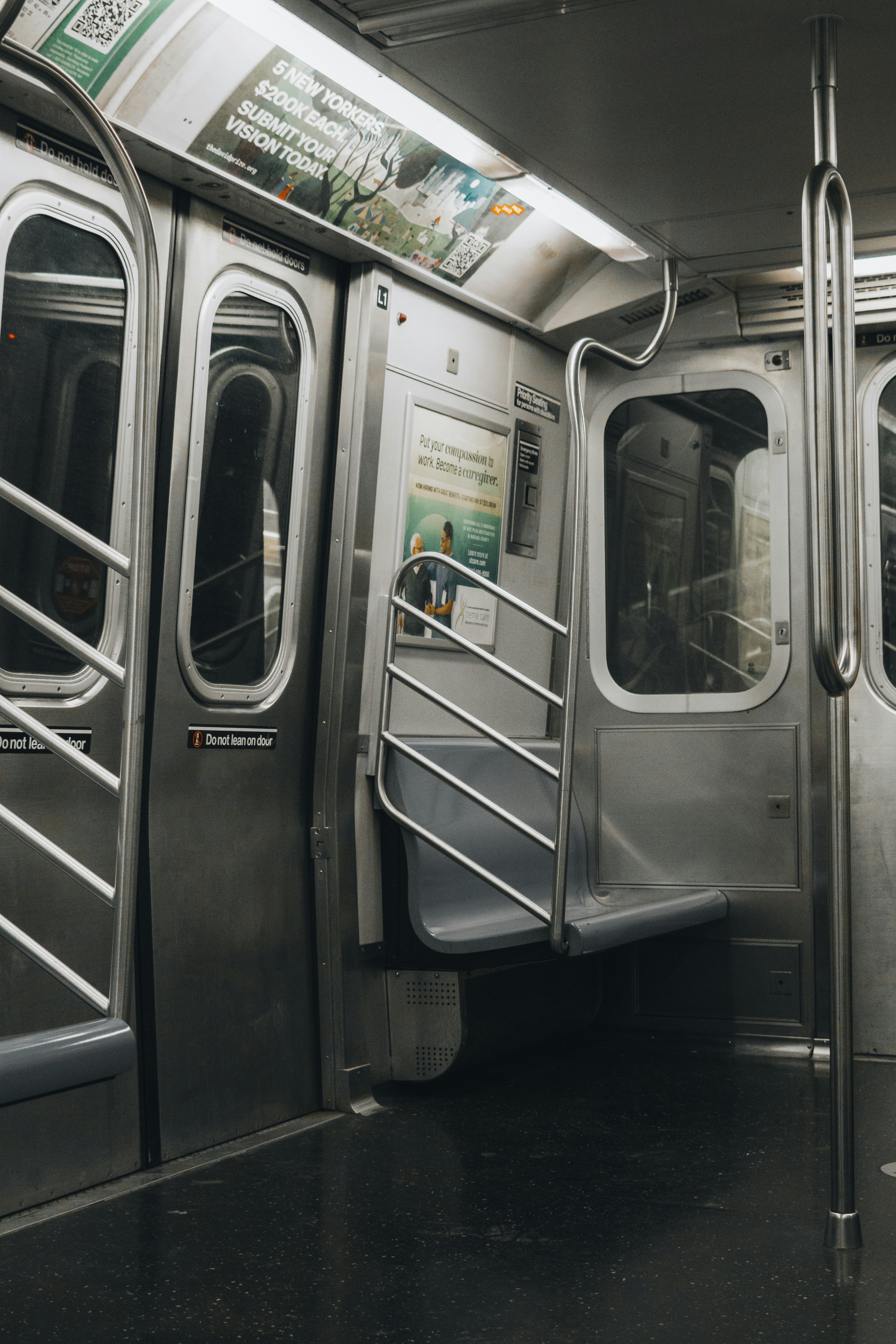 A silver subway car with its doors open photo – Free New york Image on ...