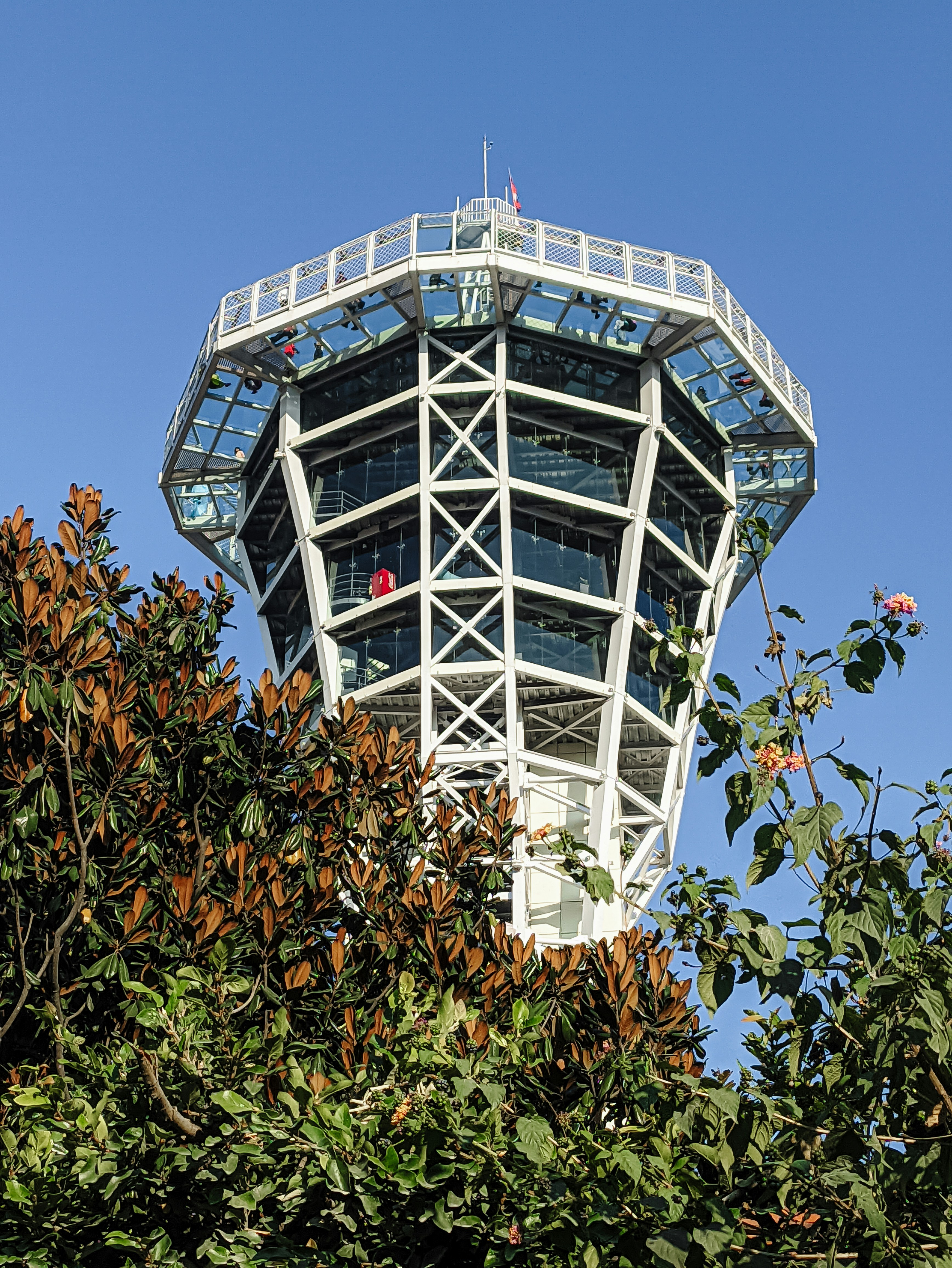 A tall tower with a metal structure on top of it photo – Free Skywalk ...