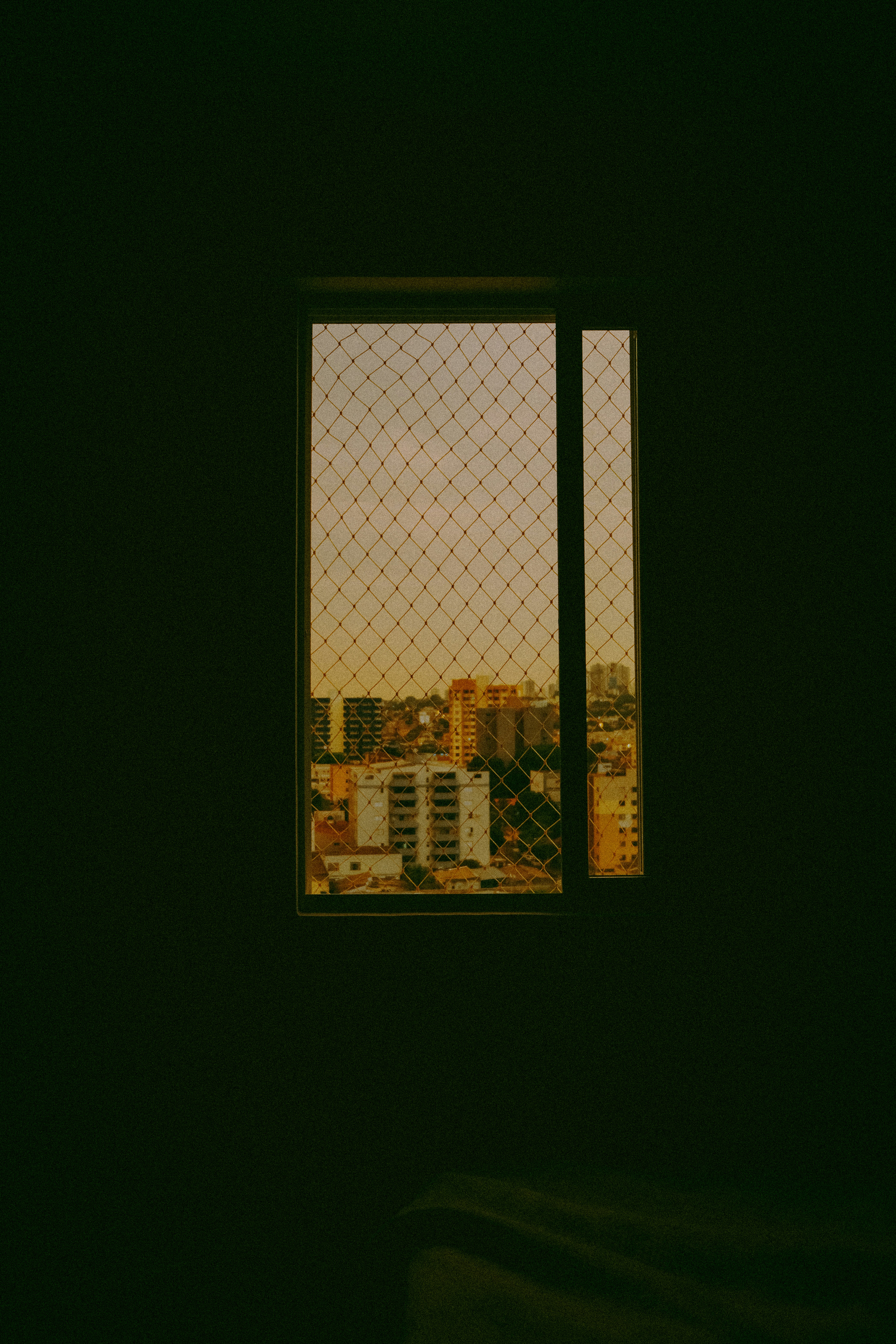 A view of a city through a window photo – Free Window Image on Unsplash