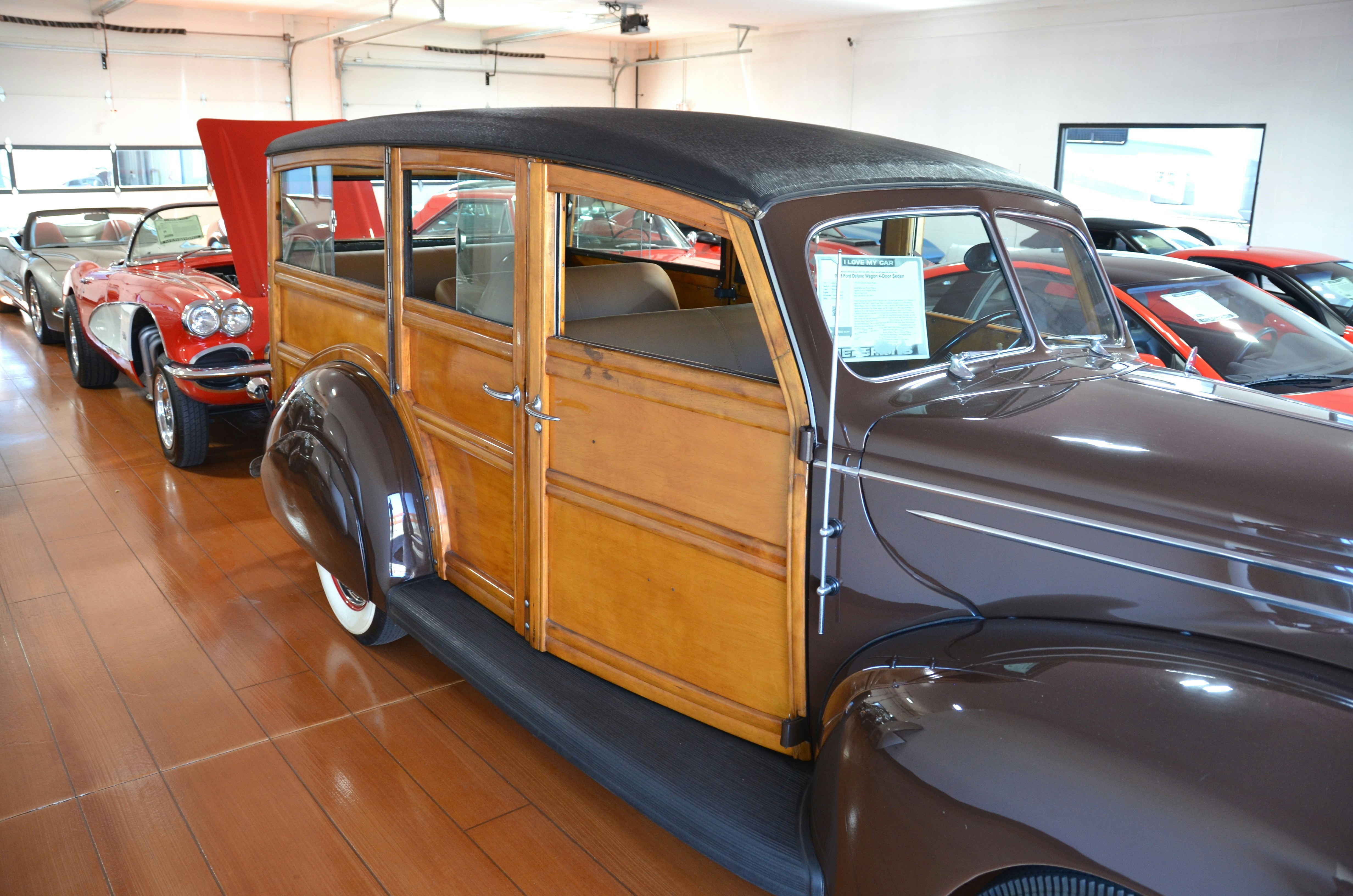 Woodie in the White Hall: A Vintage Station Wagon Anchors a Classic Car Gallery