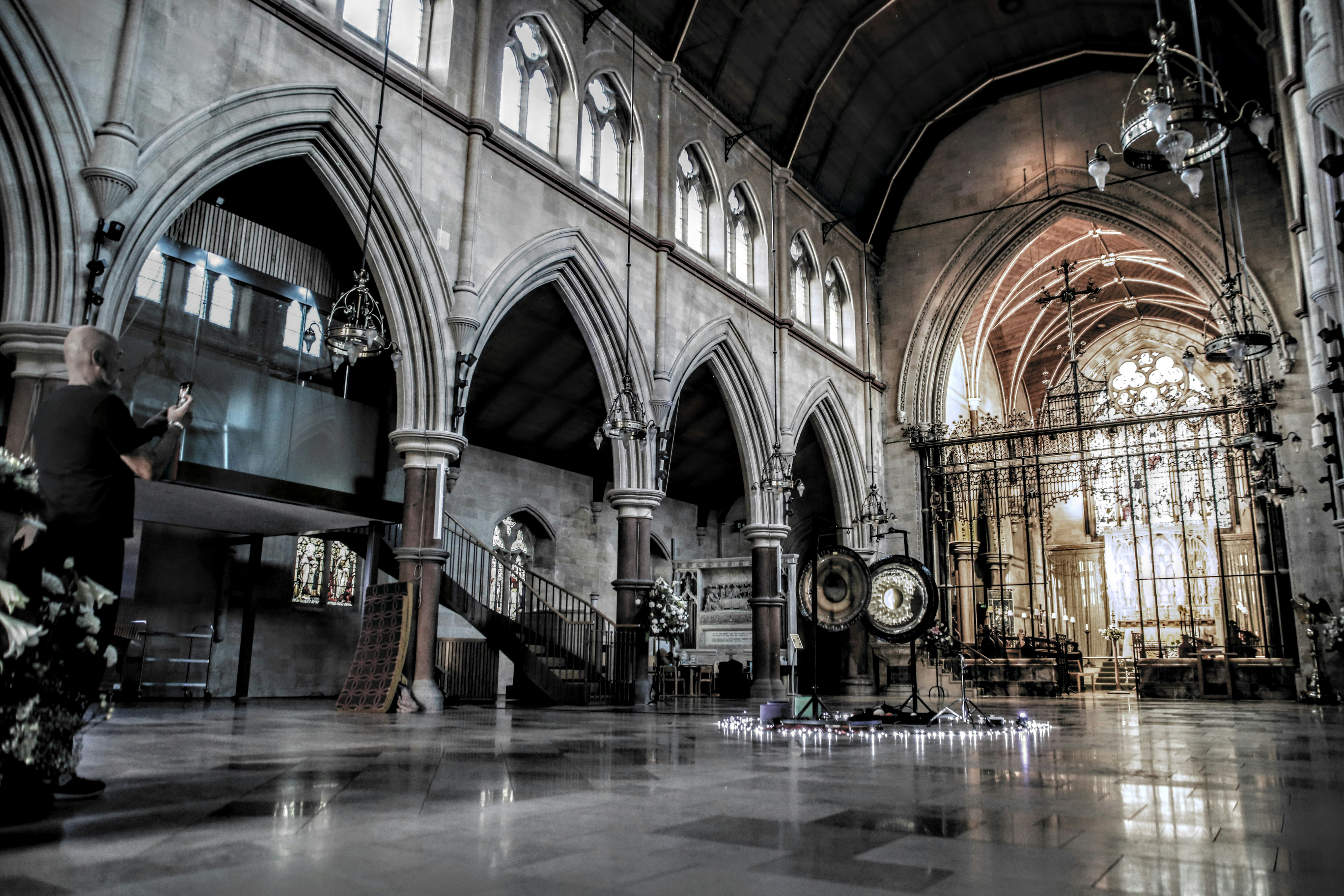 Duncan Forrester setting up for a sound bath in Cheltenham. | a large building with a bunch of clocks inside of it