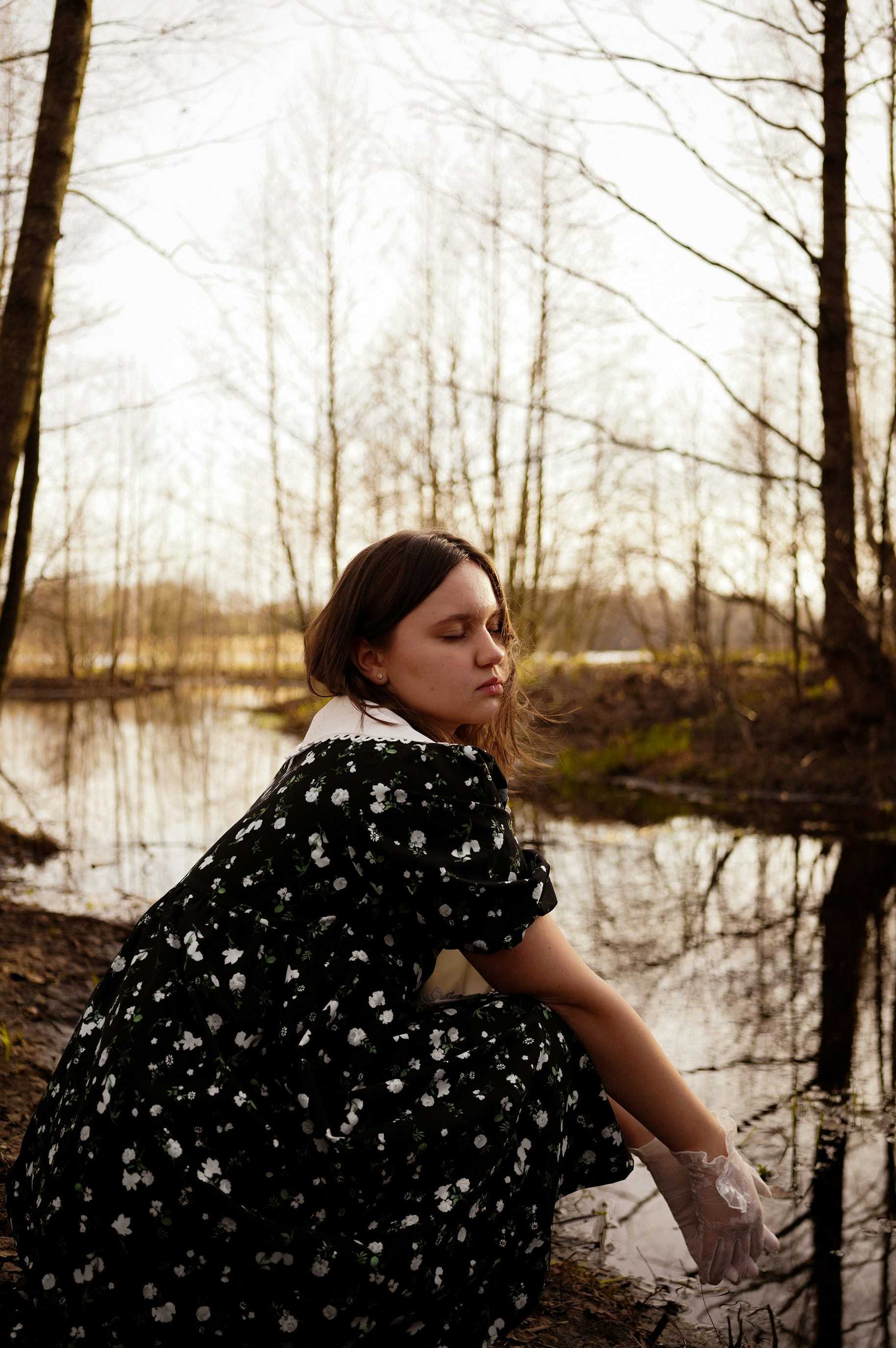 Dusk Portrait by the Reflective Pond: A Quiet Moment Among Bare Trees