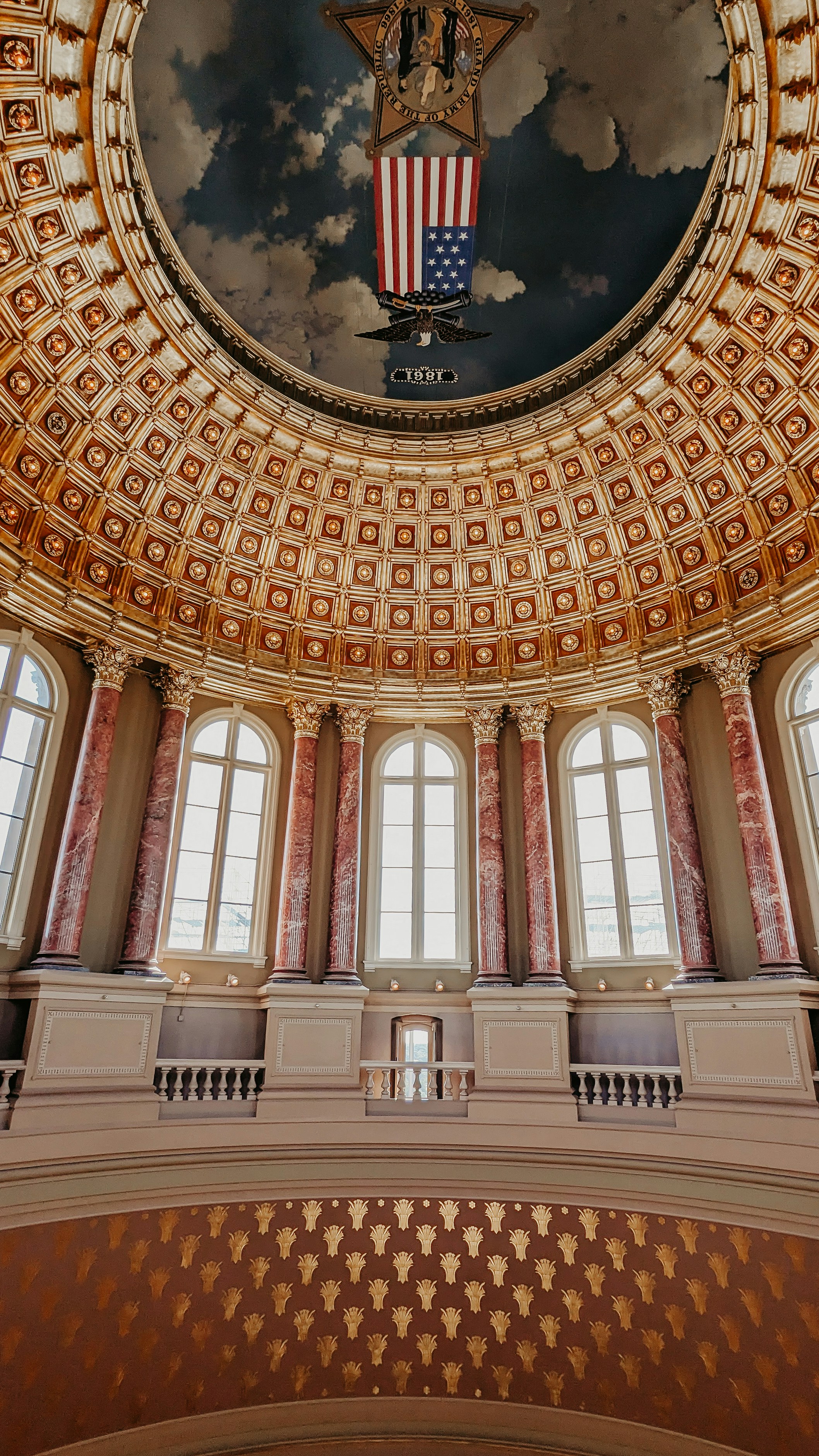 The ceiling of a large building with a painting of a crucifix on photo ...