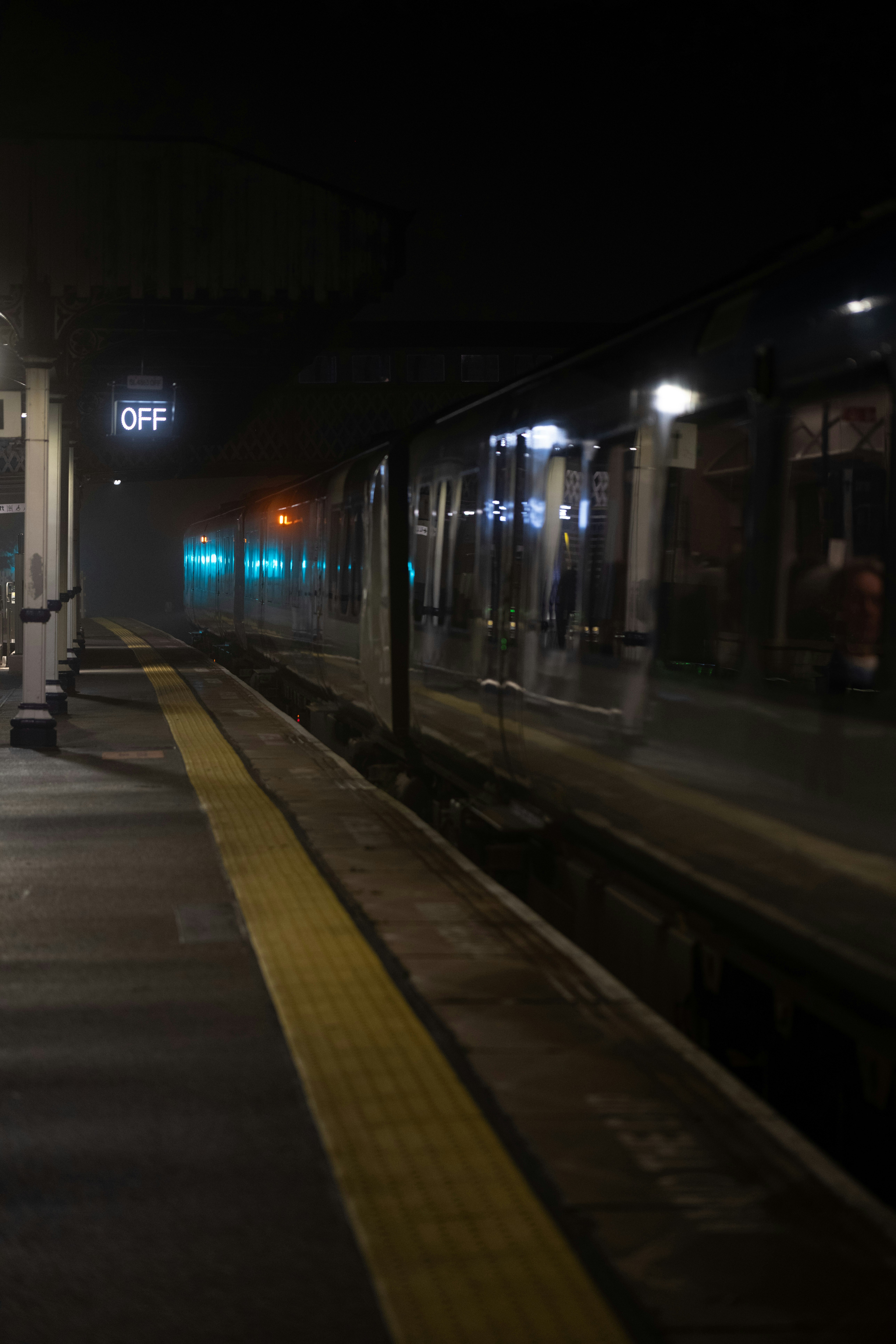Midnight Platform Drift: Neon Glow and a Blurred Train