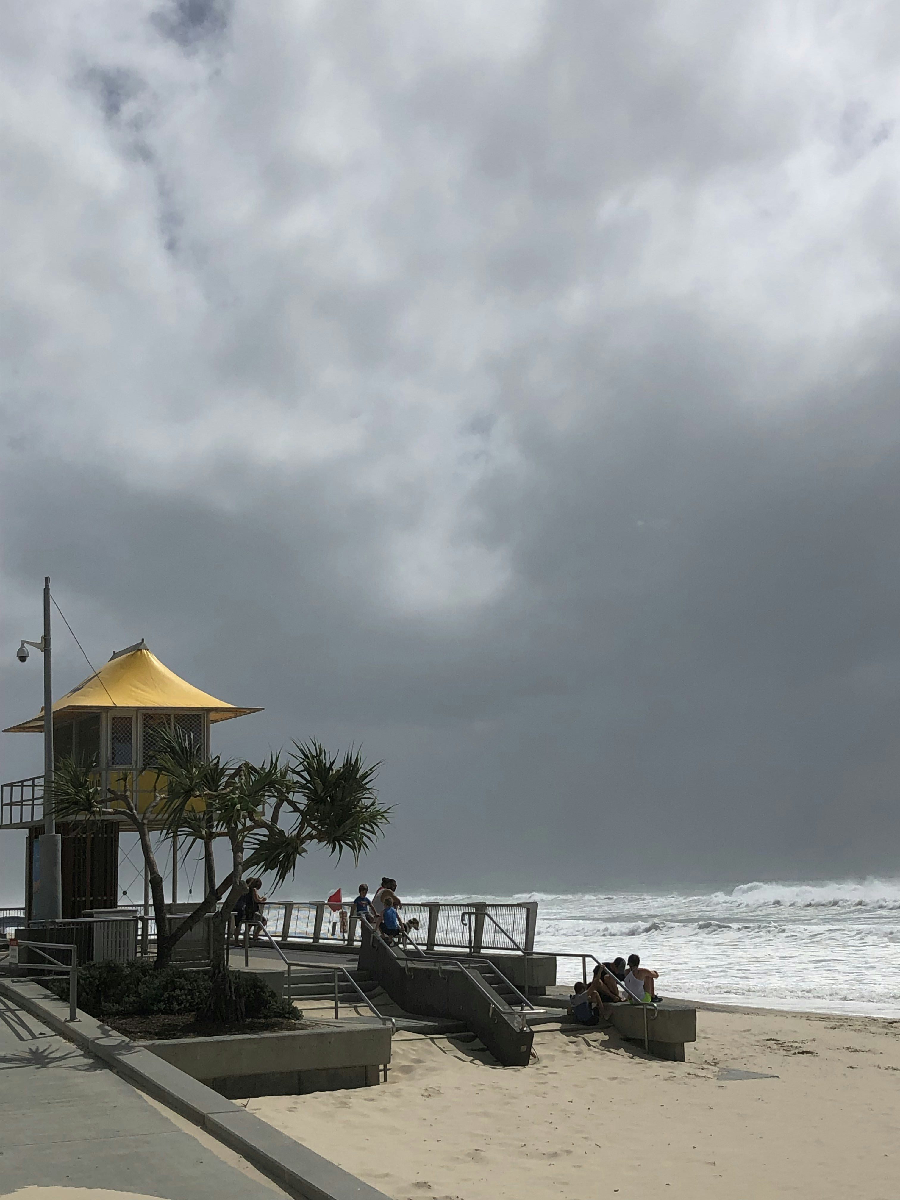 Guarded Shores Under Stormy Skies