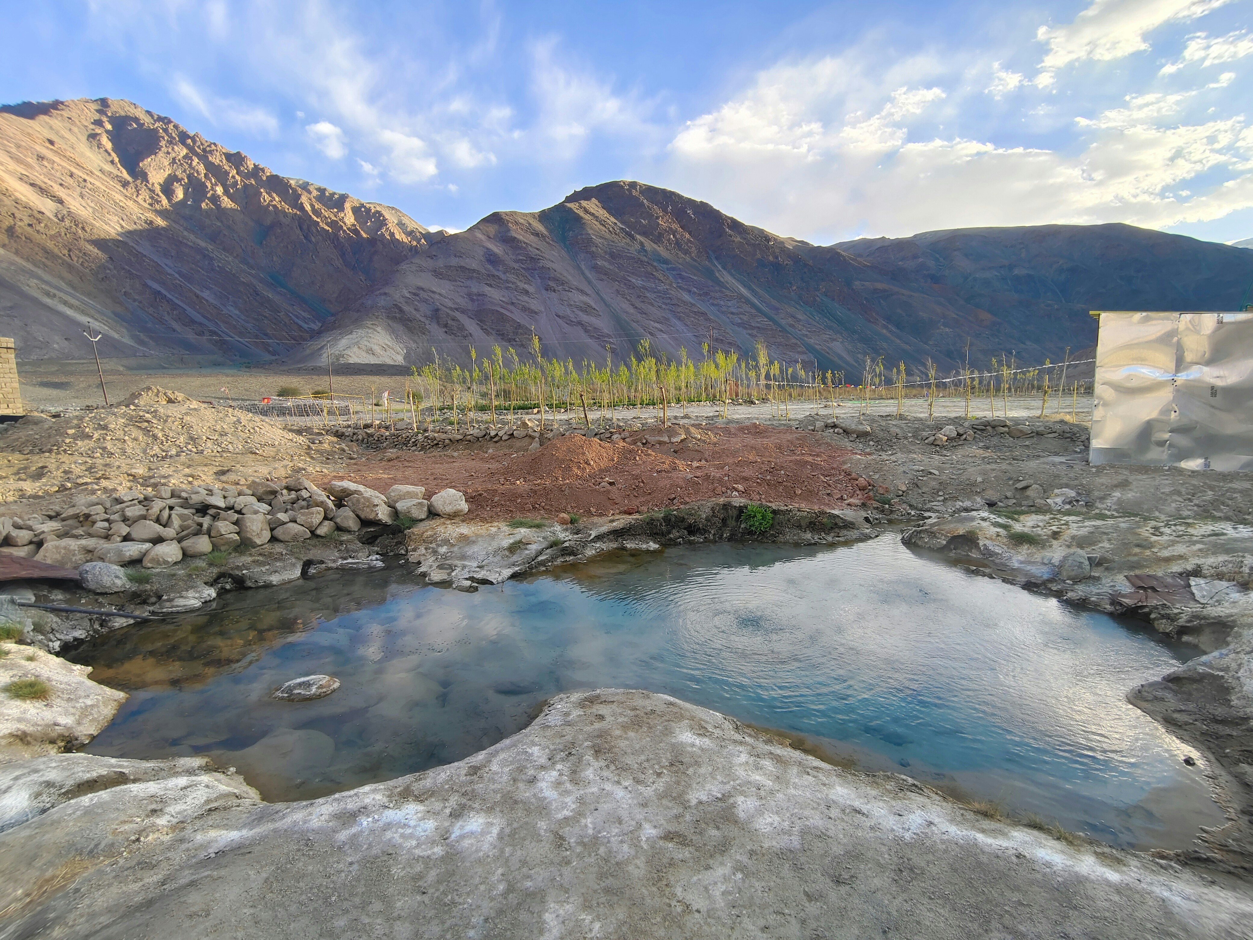 A small pool of water surrounded by mountains photo – Free Chumathang ...