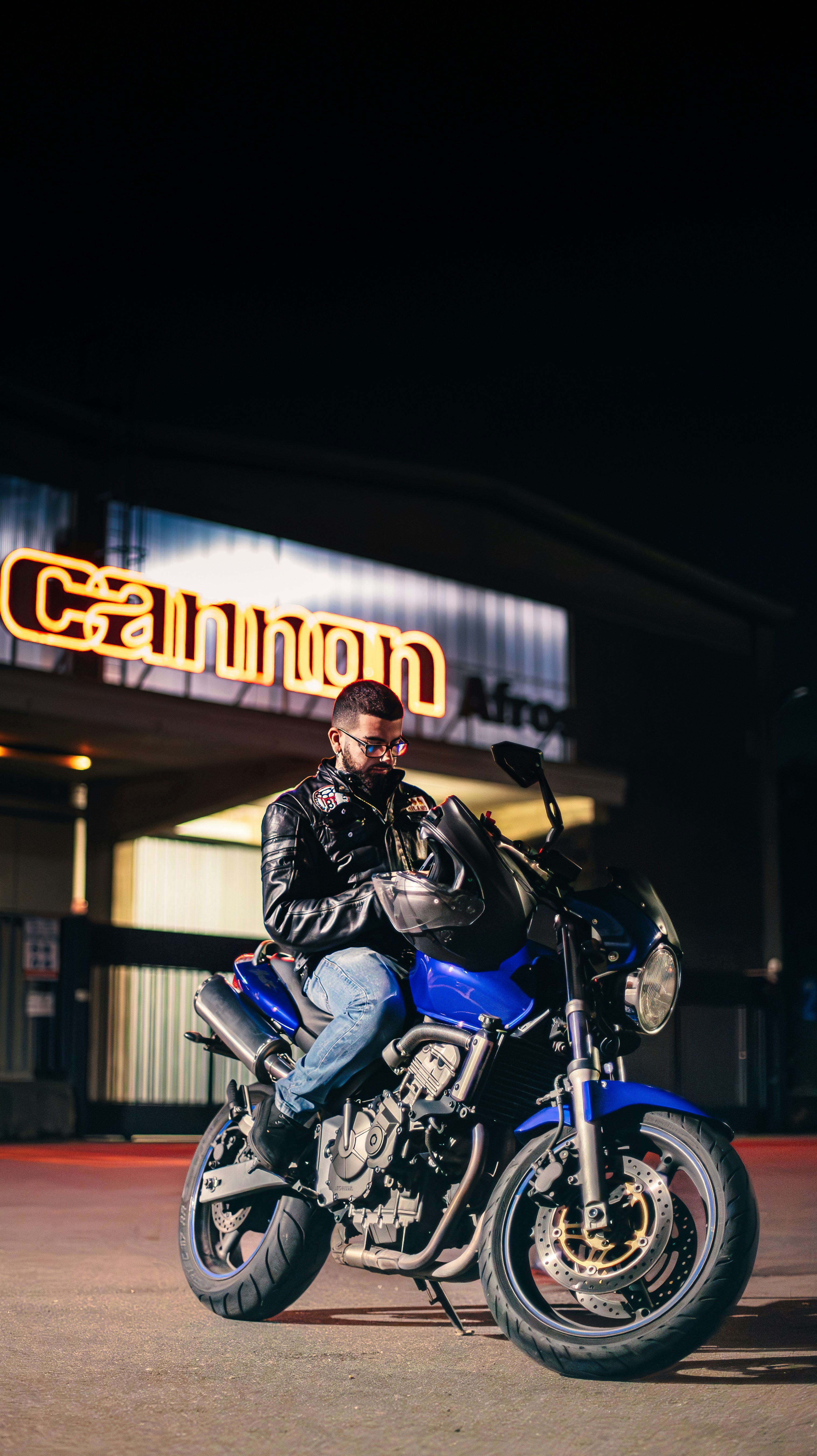 Midnight Riser: Neon-Backlit Rider and Blue Streetbike